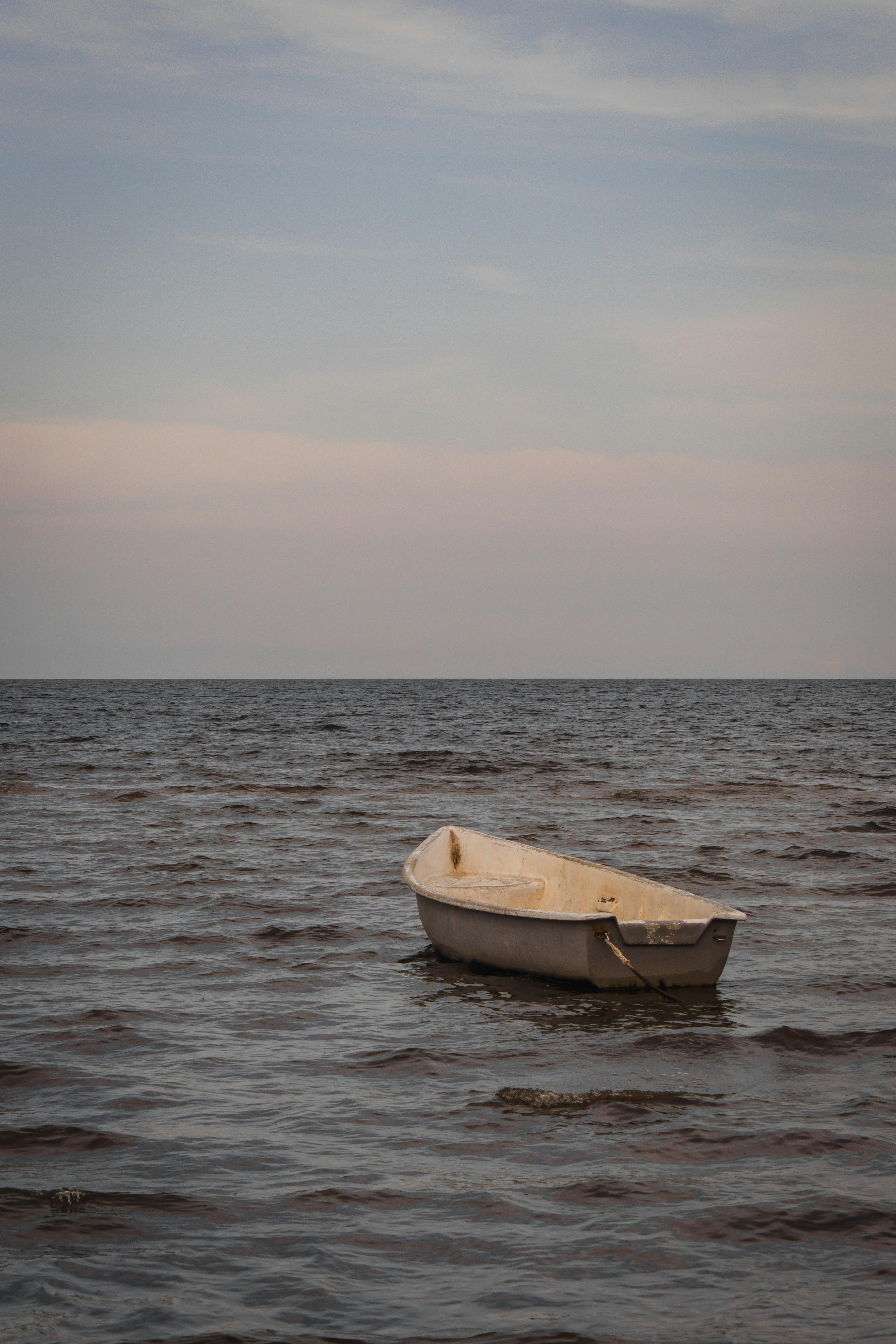 Empty Boat on Wavy Water · Free Stock Photo