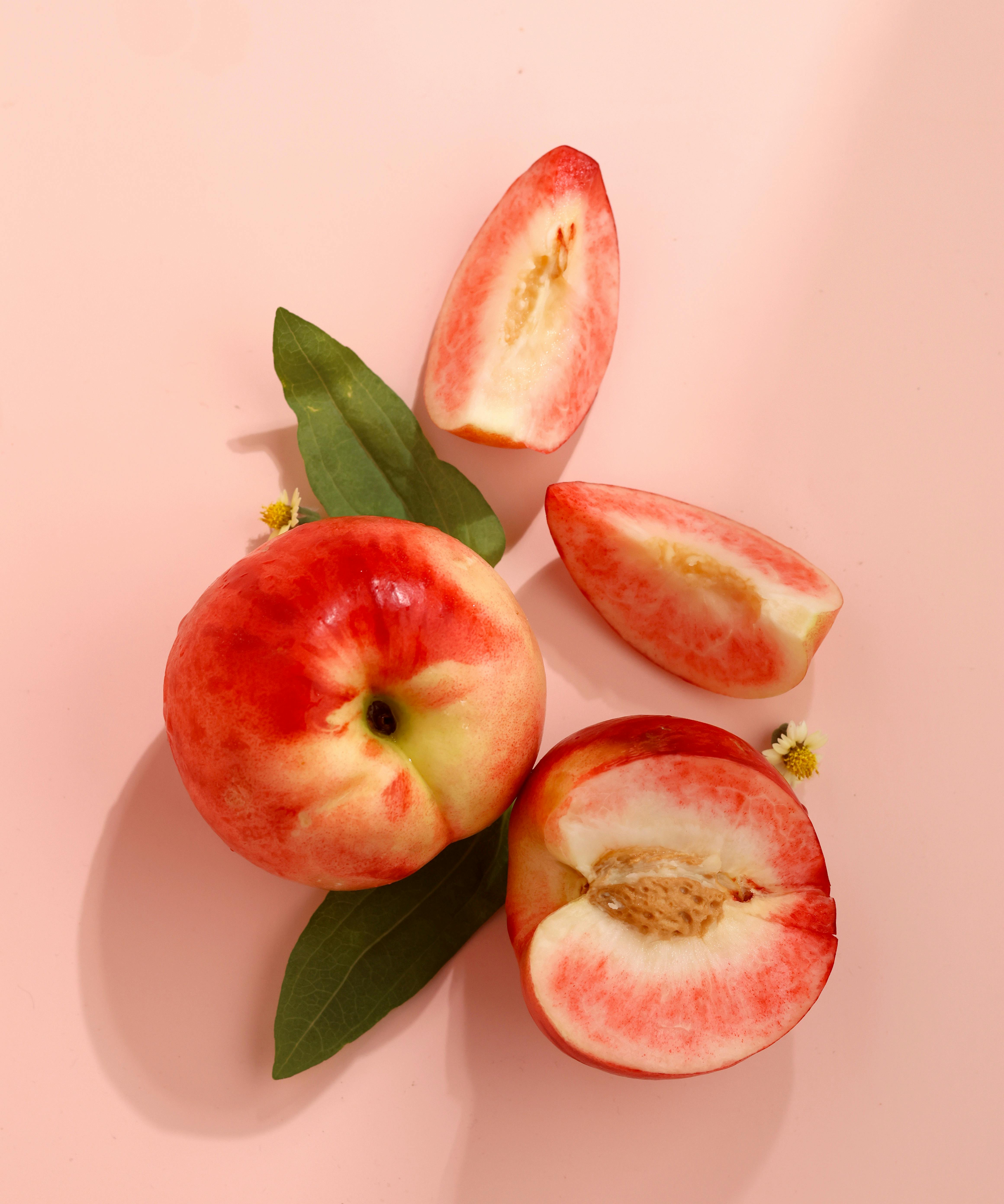 Fresh Peaches against a Pastel Colored Background · Free Stock Photo