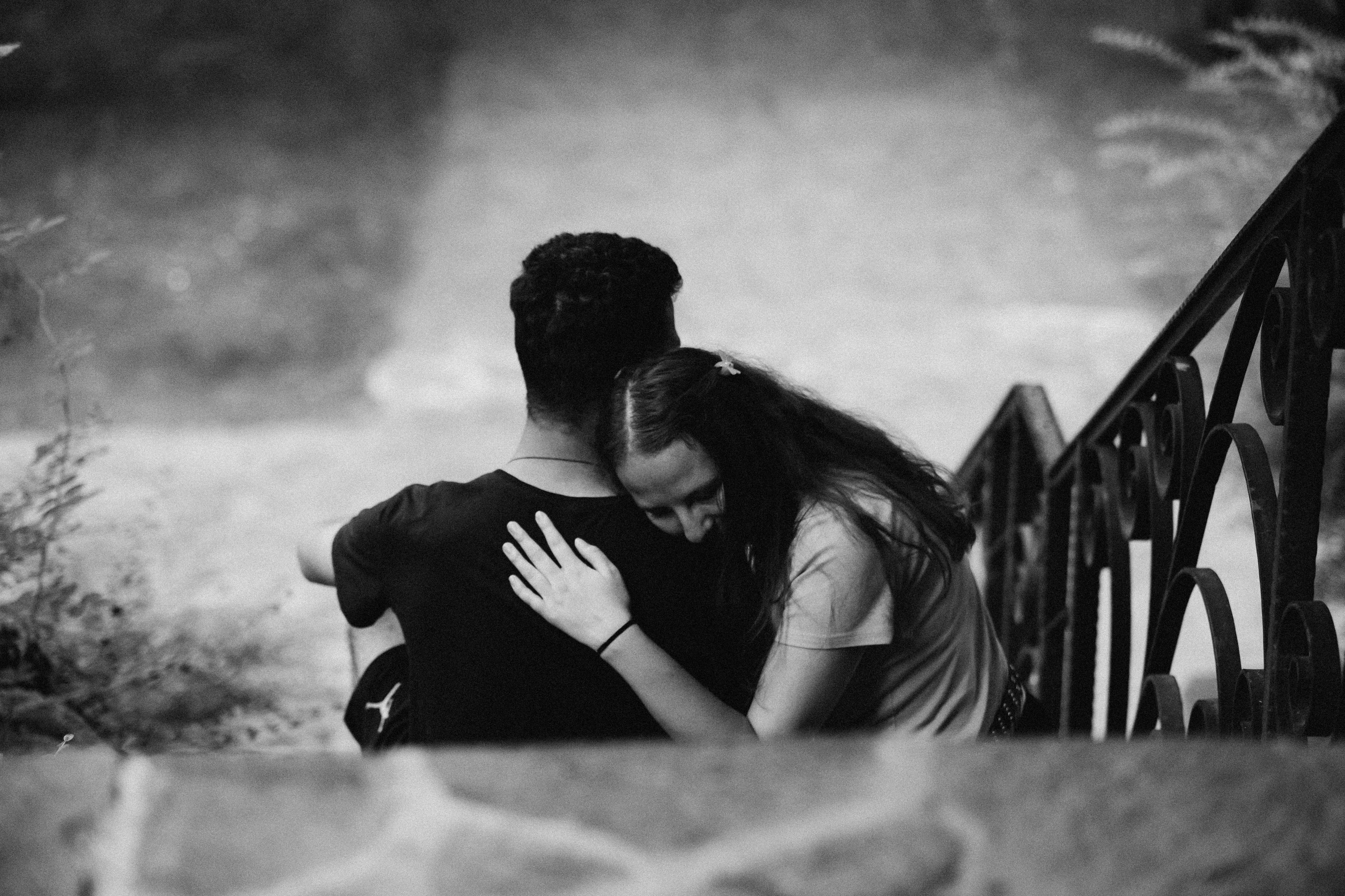 Hugging Couple on the Stairs · Free Stock Photo