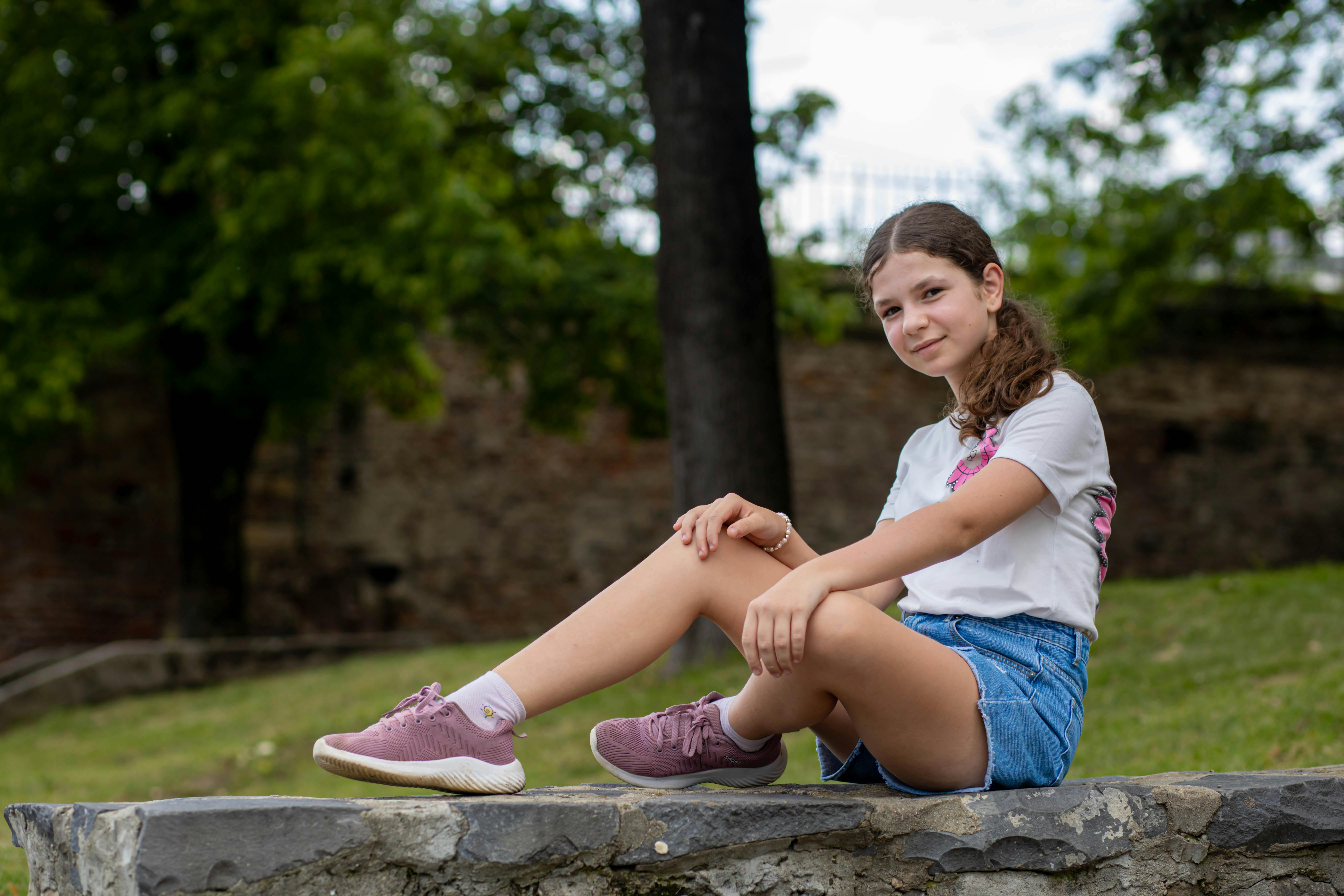 Girl Sitting in a Park · Free Stock Photo