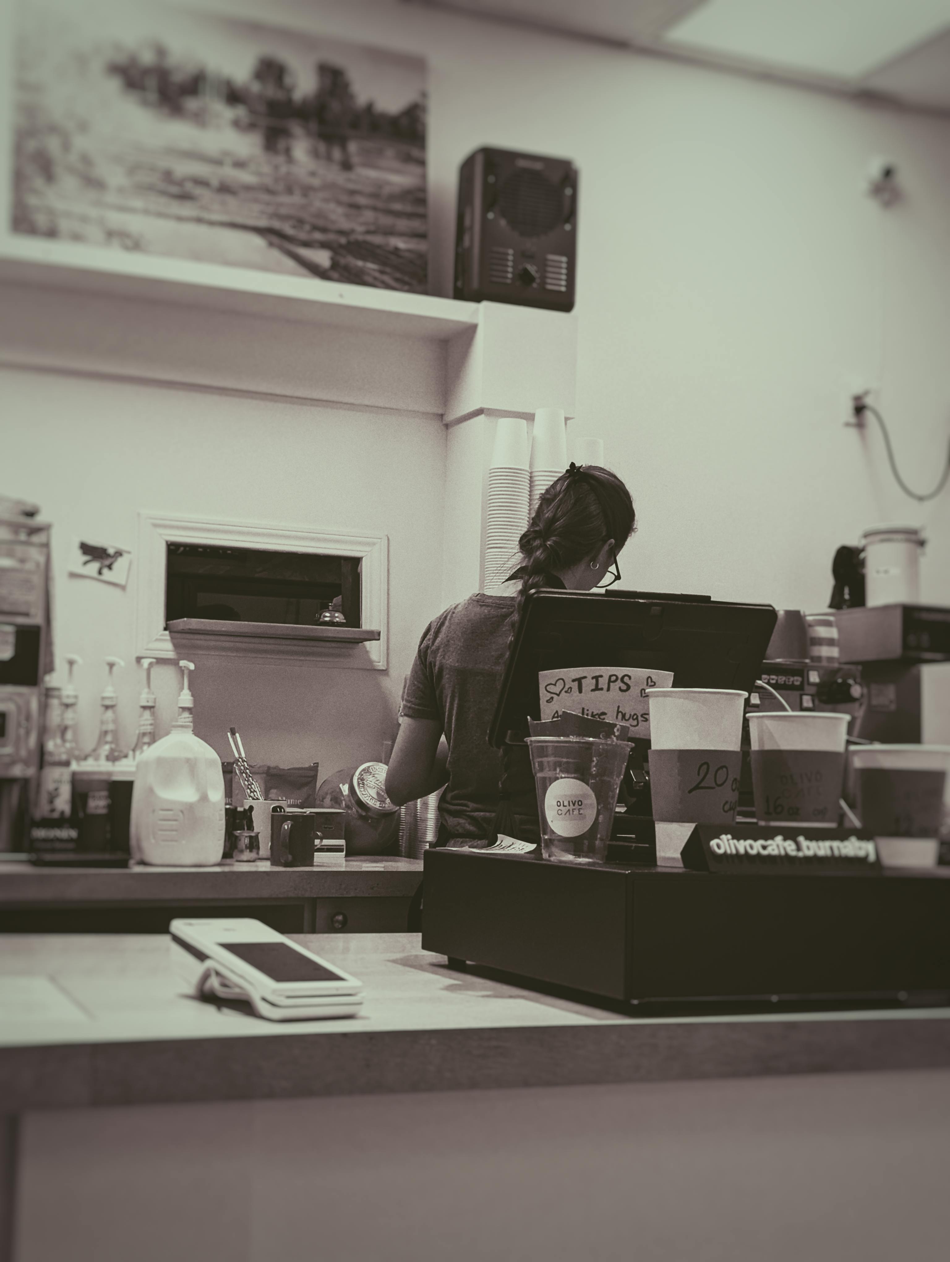 Woman Standing by Counter in Food Bar · Free Stock Photo