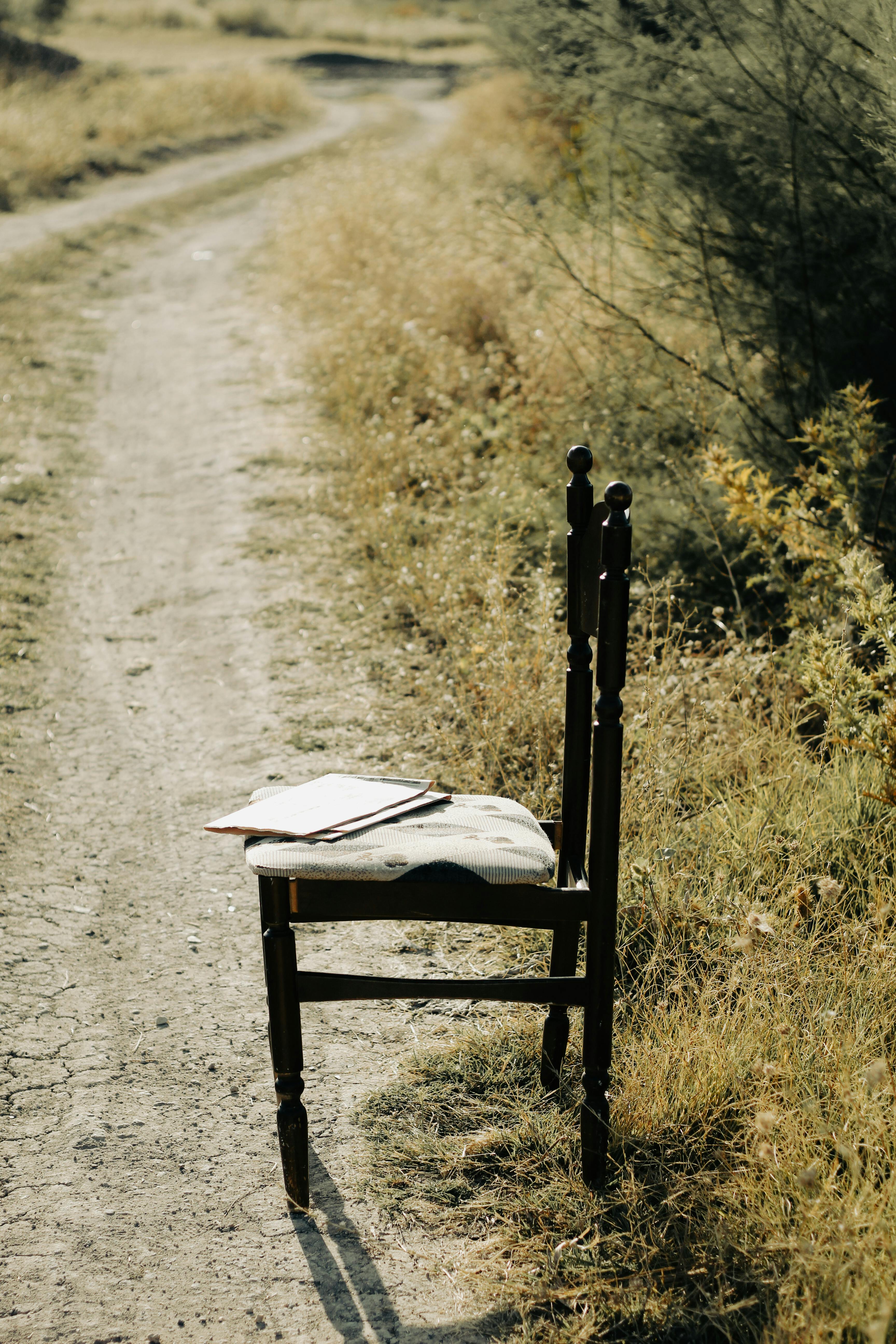Wooden Chair on Dirt Road in Countryside · Free Stock Photo