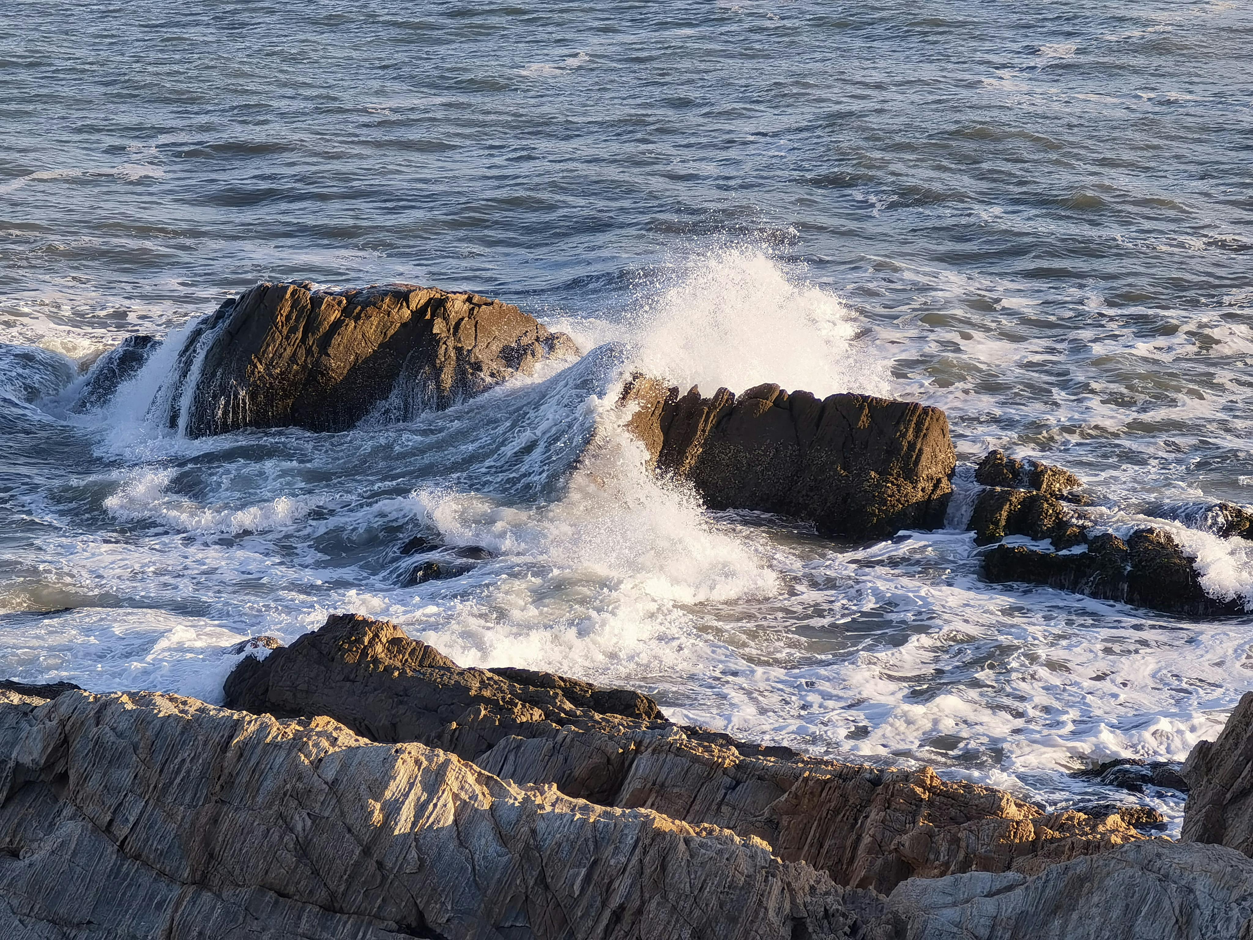Waves of a Sea Hitting the Rocks · Free Stock Photo