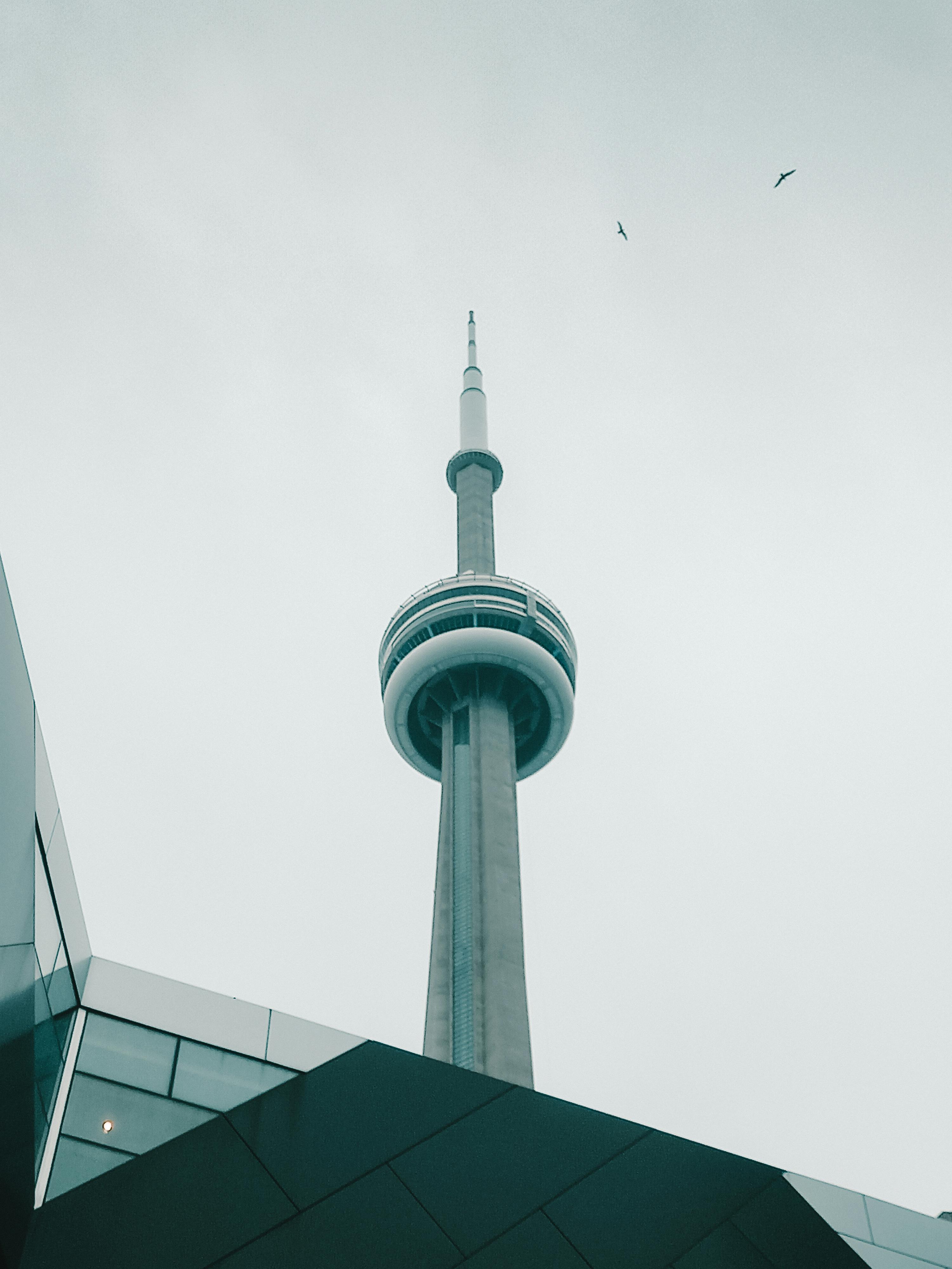 Low-angle Photography of Red and White Tower · Free Stock Photo