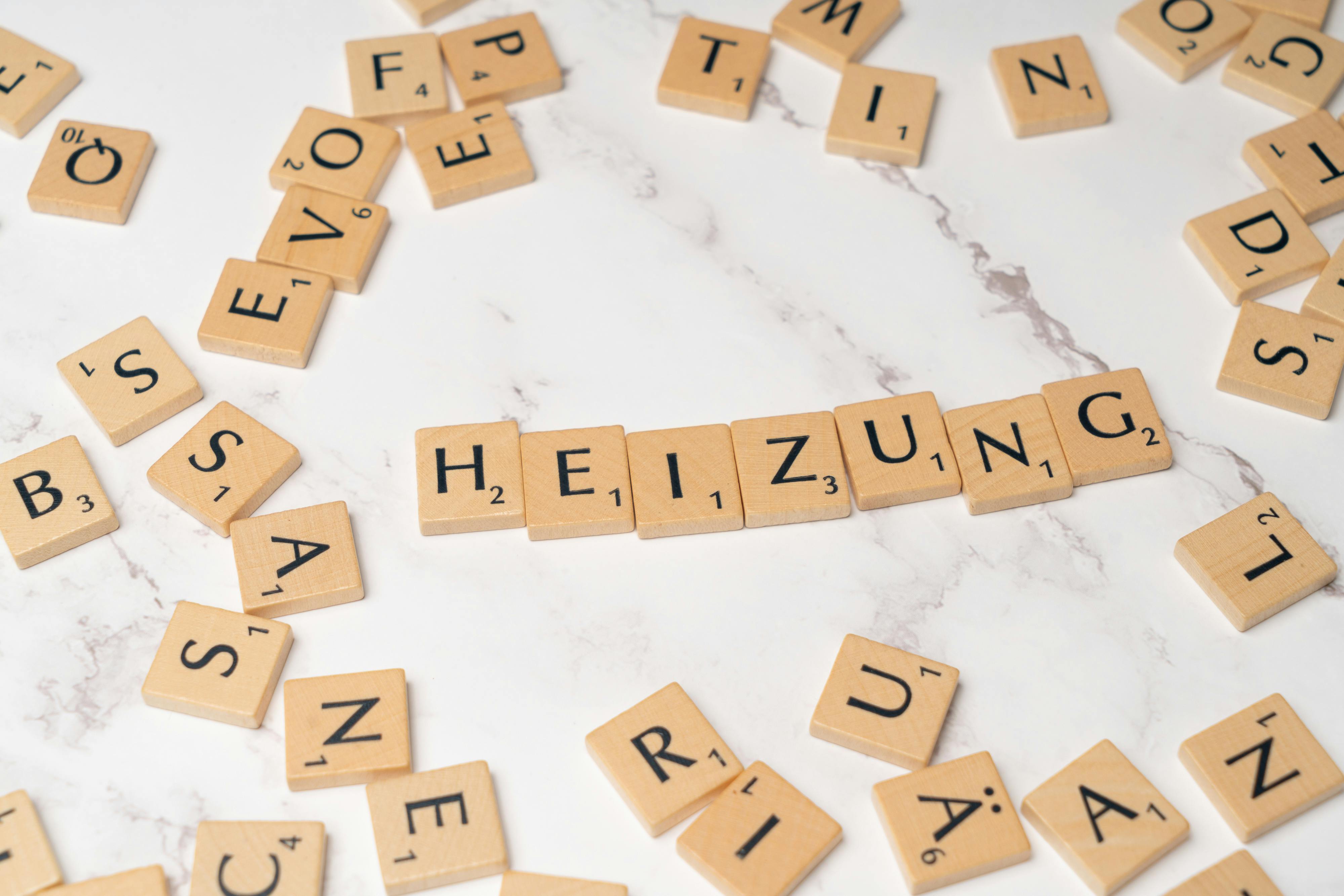Scrabble tiles spelling heinzung · Free Stock Photo