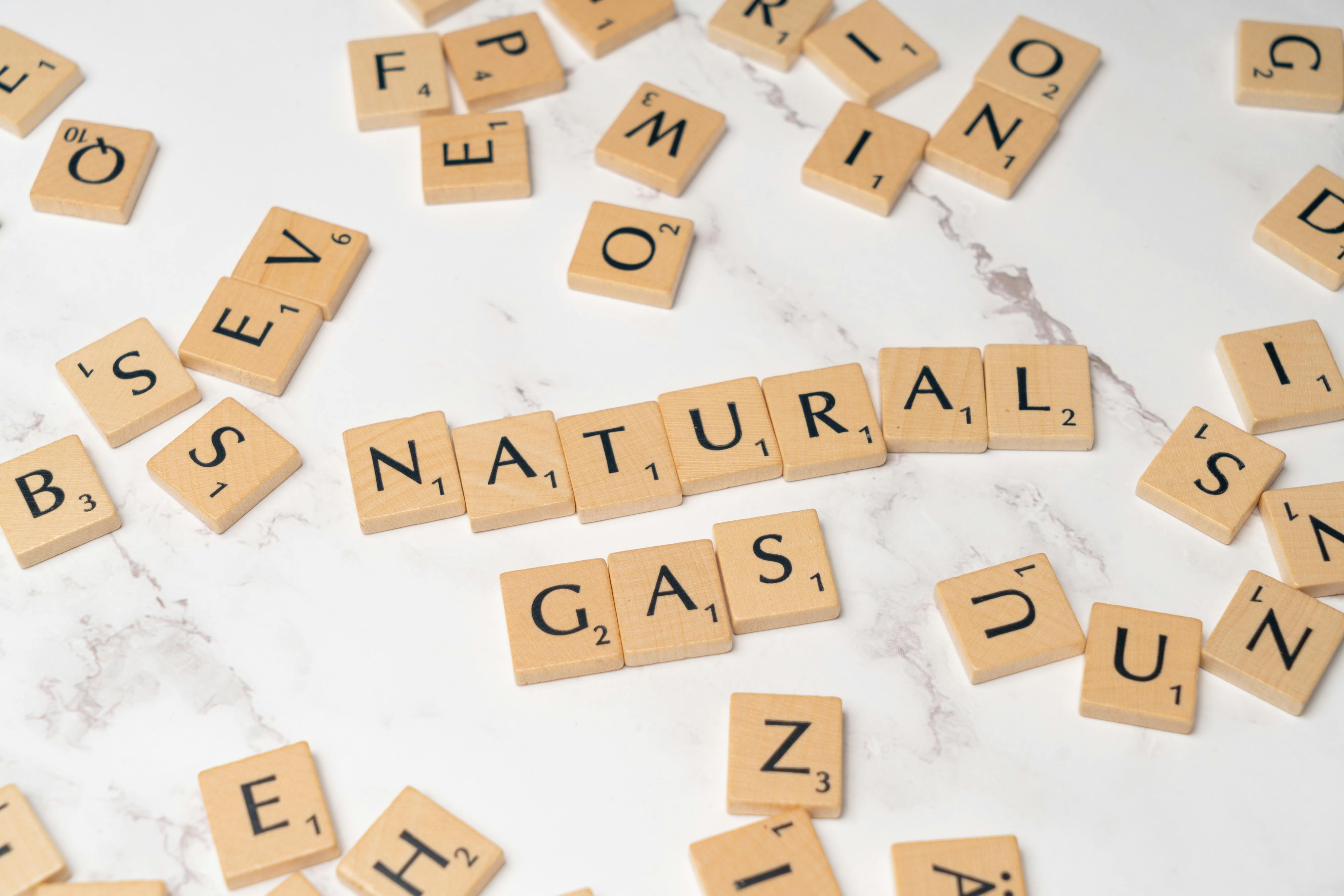 Natural gas is spelled out in scrabble tiles · Free Stock Photo