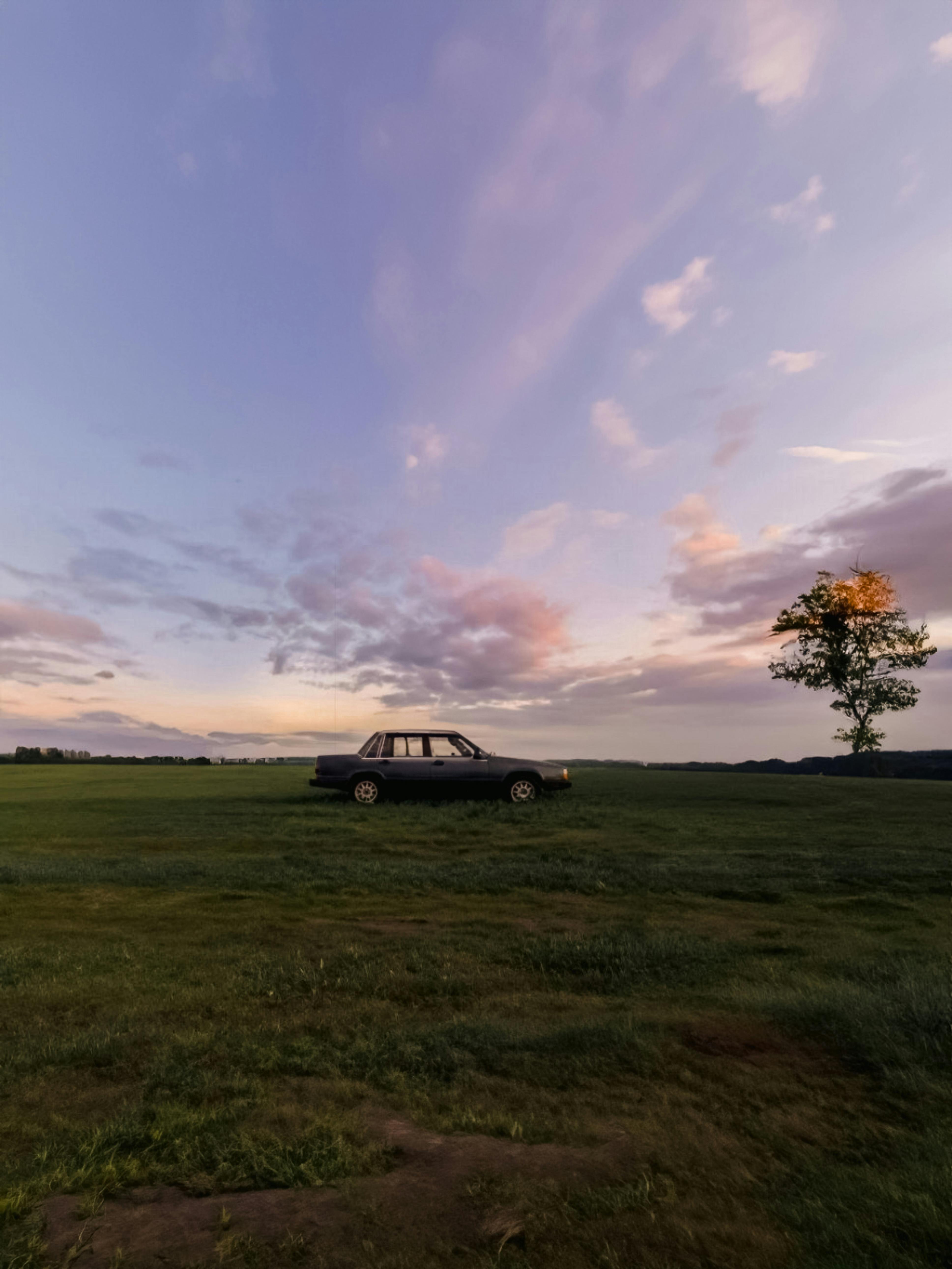 Vintage Car in Serene Evening Landscape · Free Stock Photo