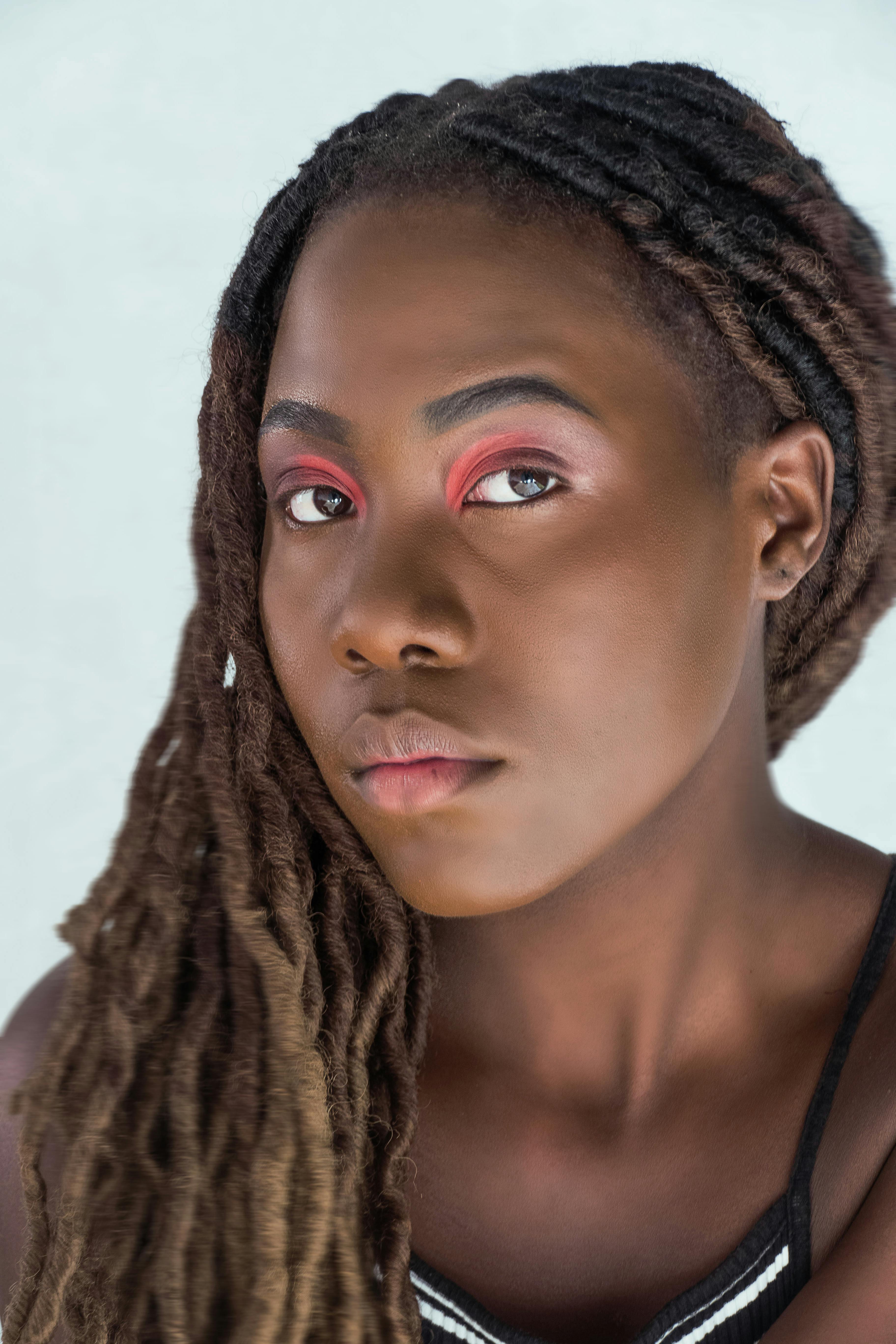 Beautiful Woman with Dreadlocks Posing with Her Hand on Her Chin · Free ...