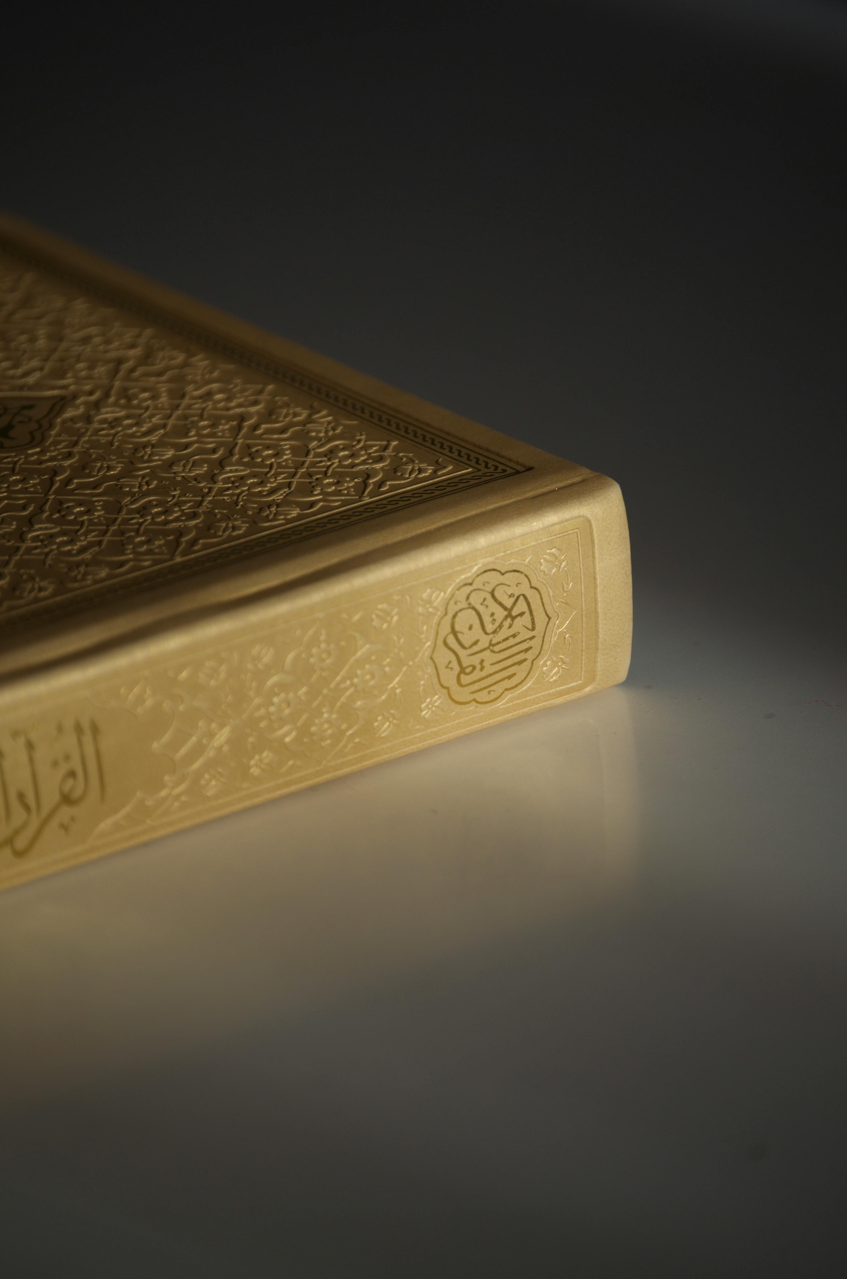 Smartphone and Koran Book on Table · Free Stock Photo