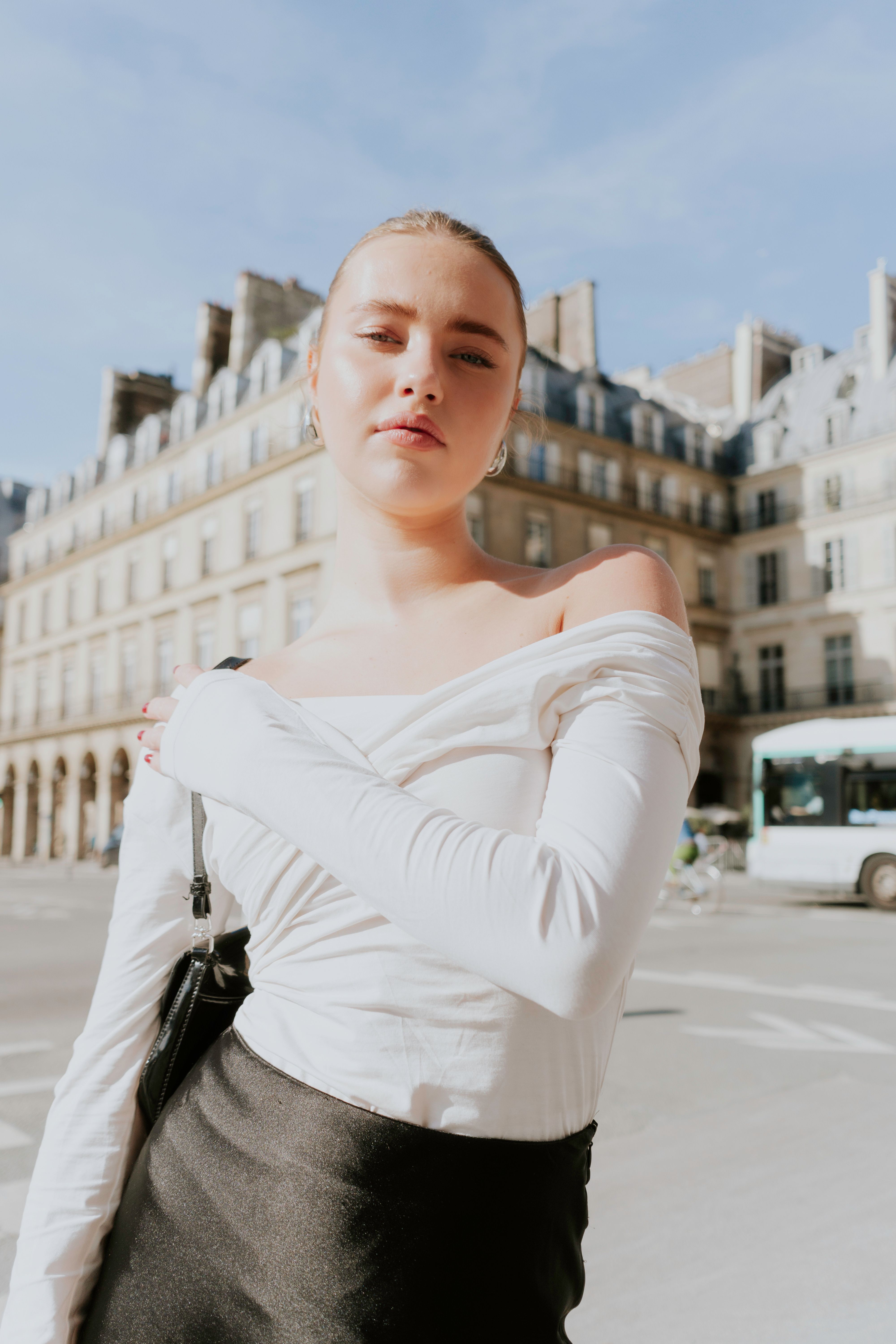 Model Posing in White Clothes on Street · Free Stock Photo