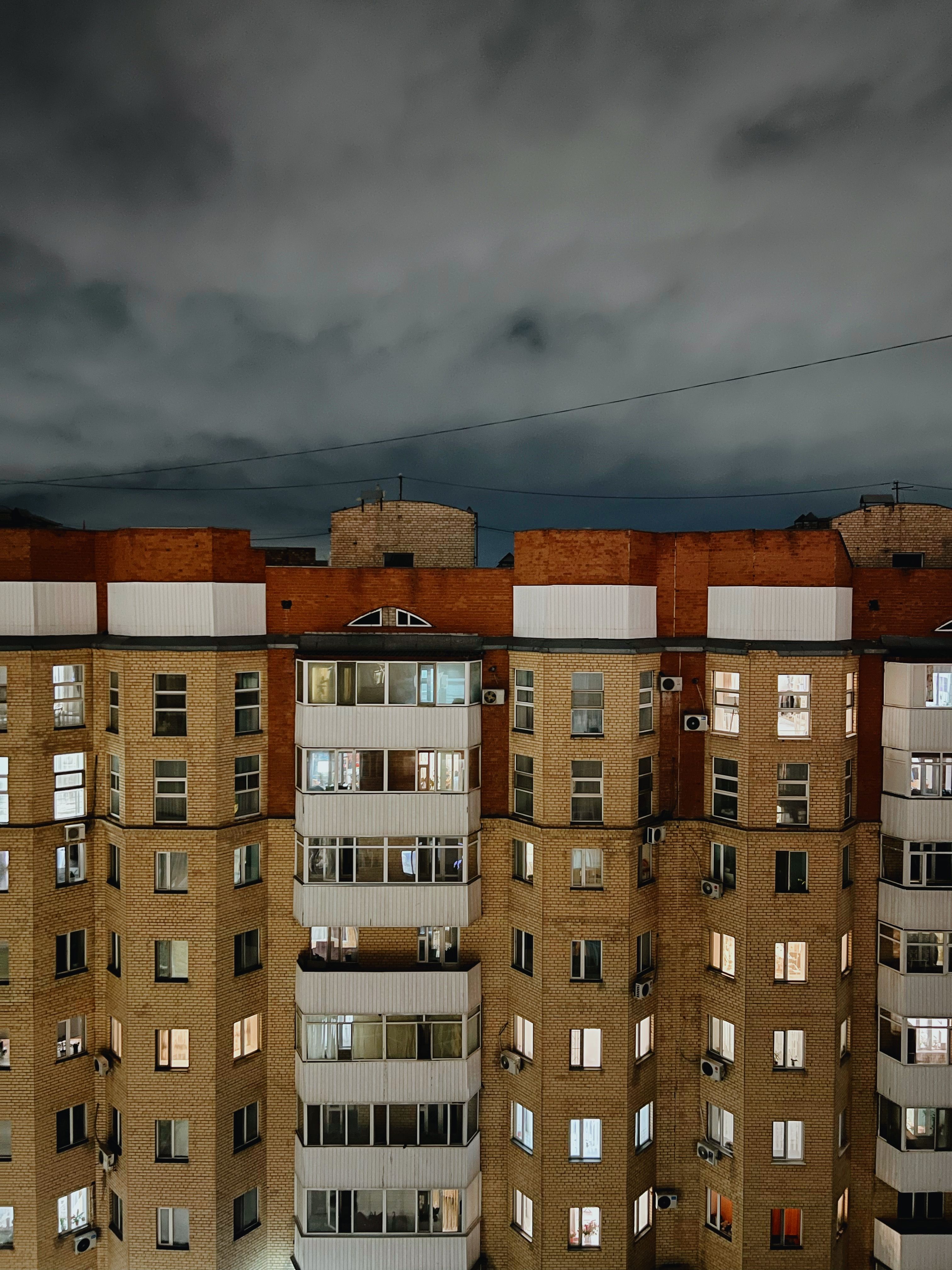 Residential Building under Storm Clouds · Free Stock Photo