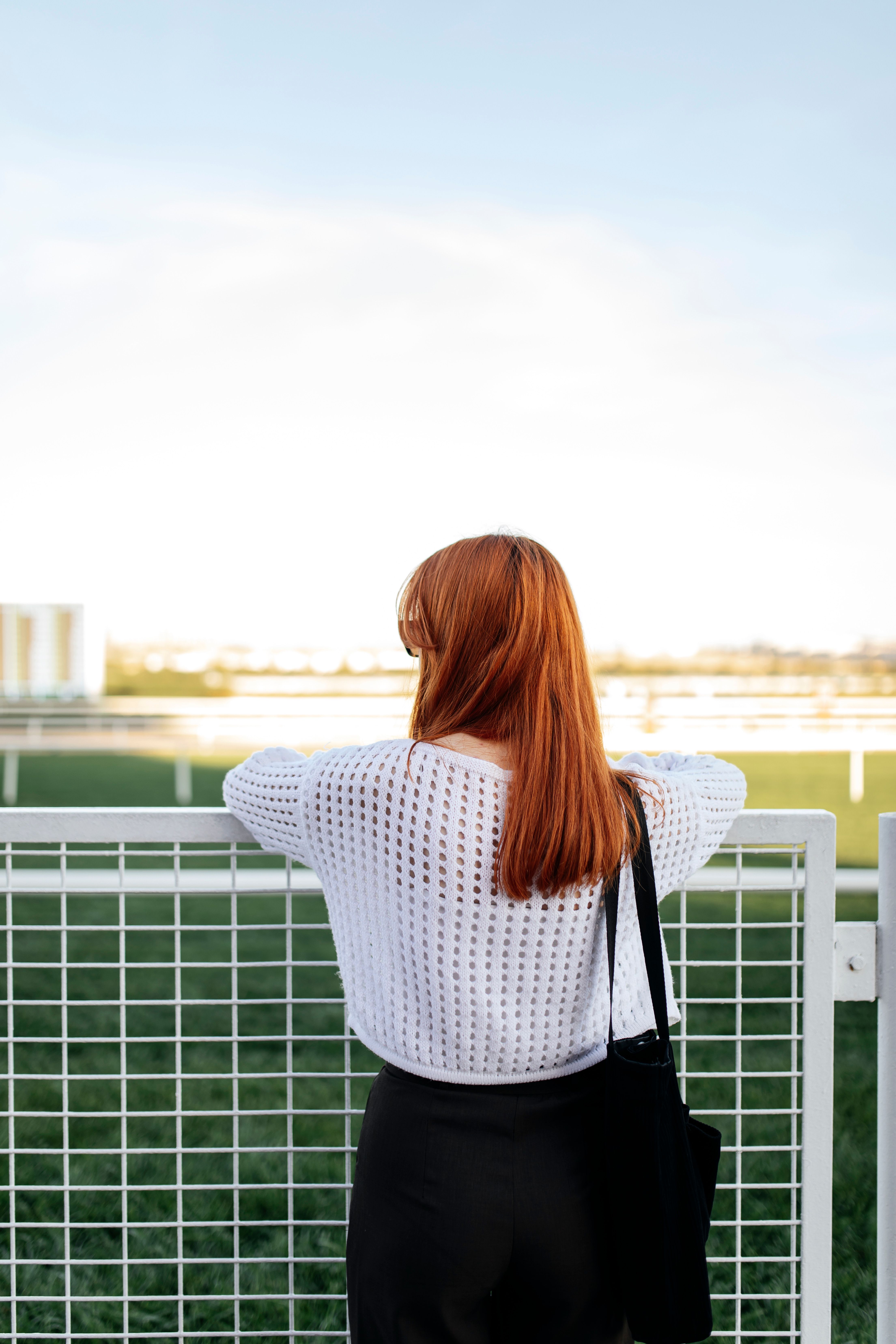 Back View of Redhead Woman at Stadium · Free Stock Photo