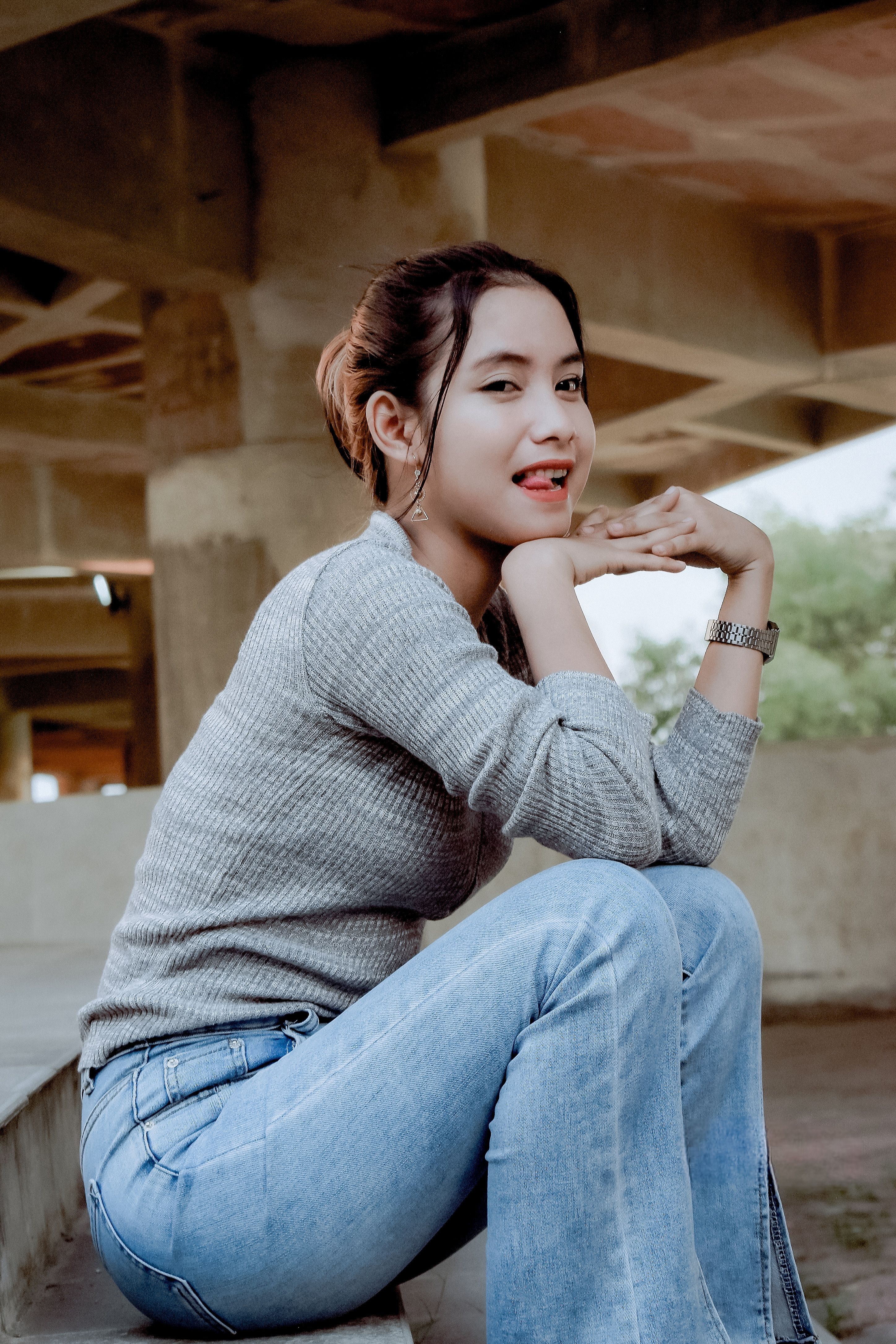 Smiling Woman Sitting · Free Stock Photo