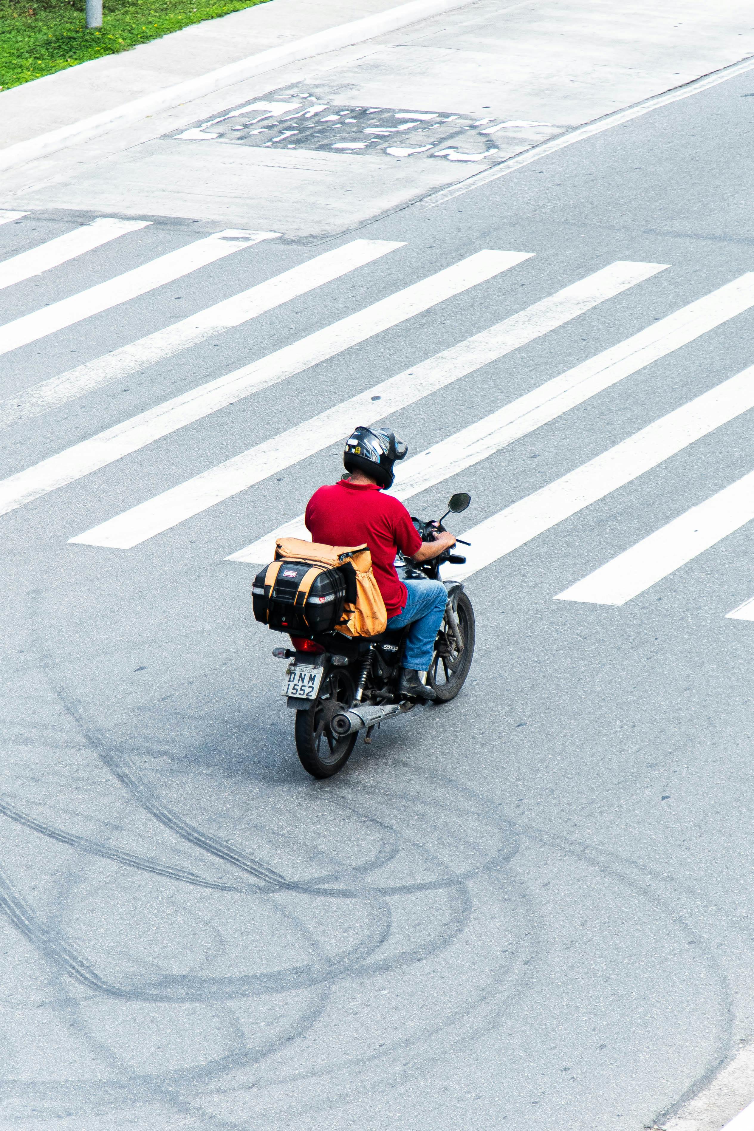 Man Riding Motor Scooter on Street · Free Stock Photo