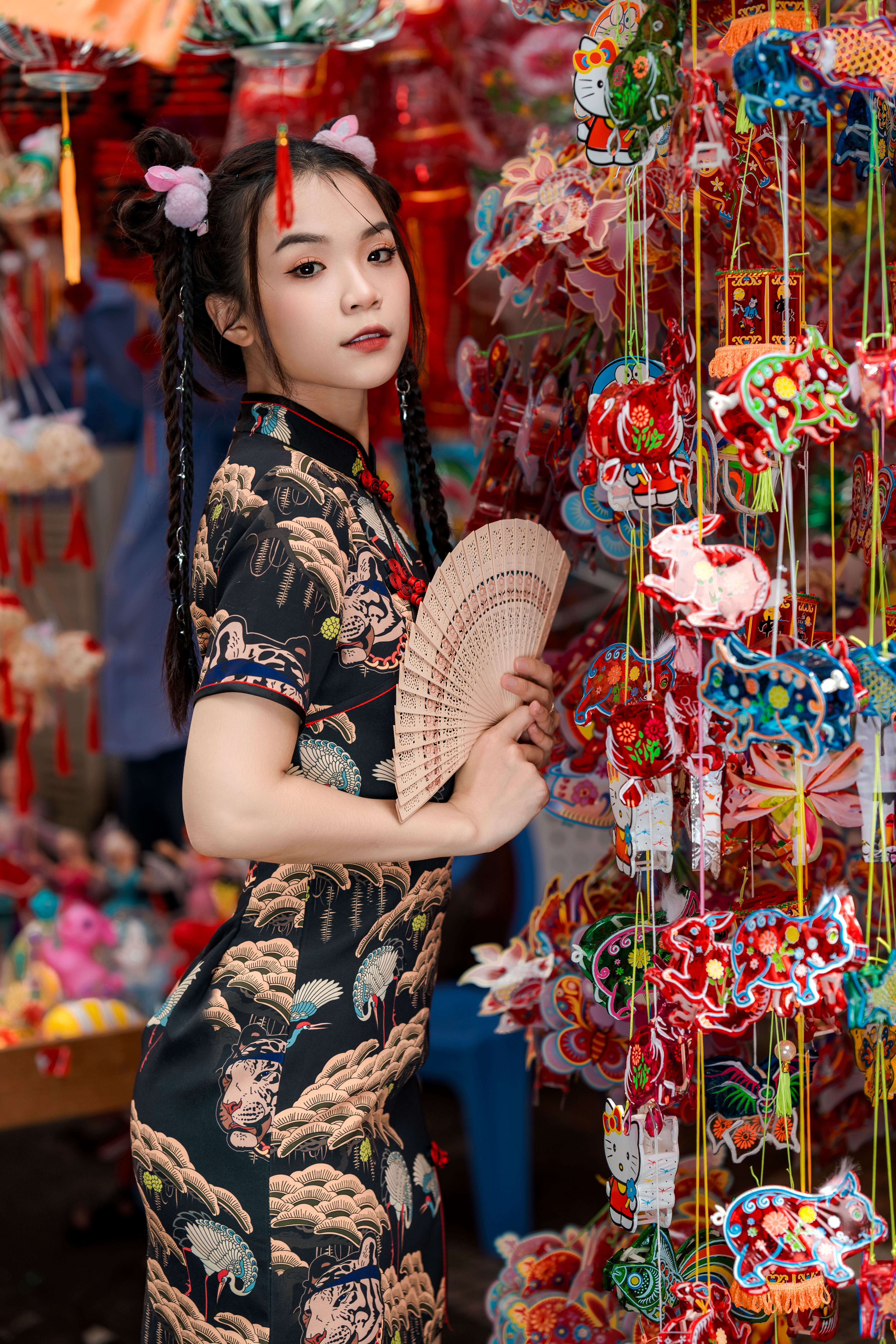 Young Chinese Woman with a Fan in her Hand · Free Stock Photo
