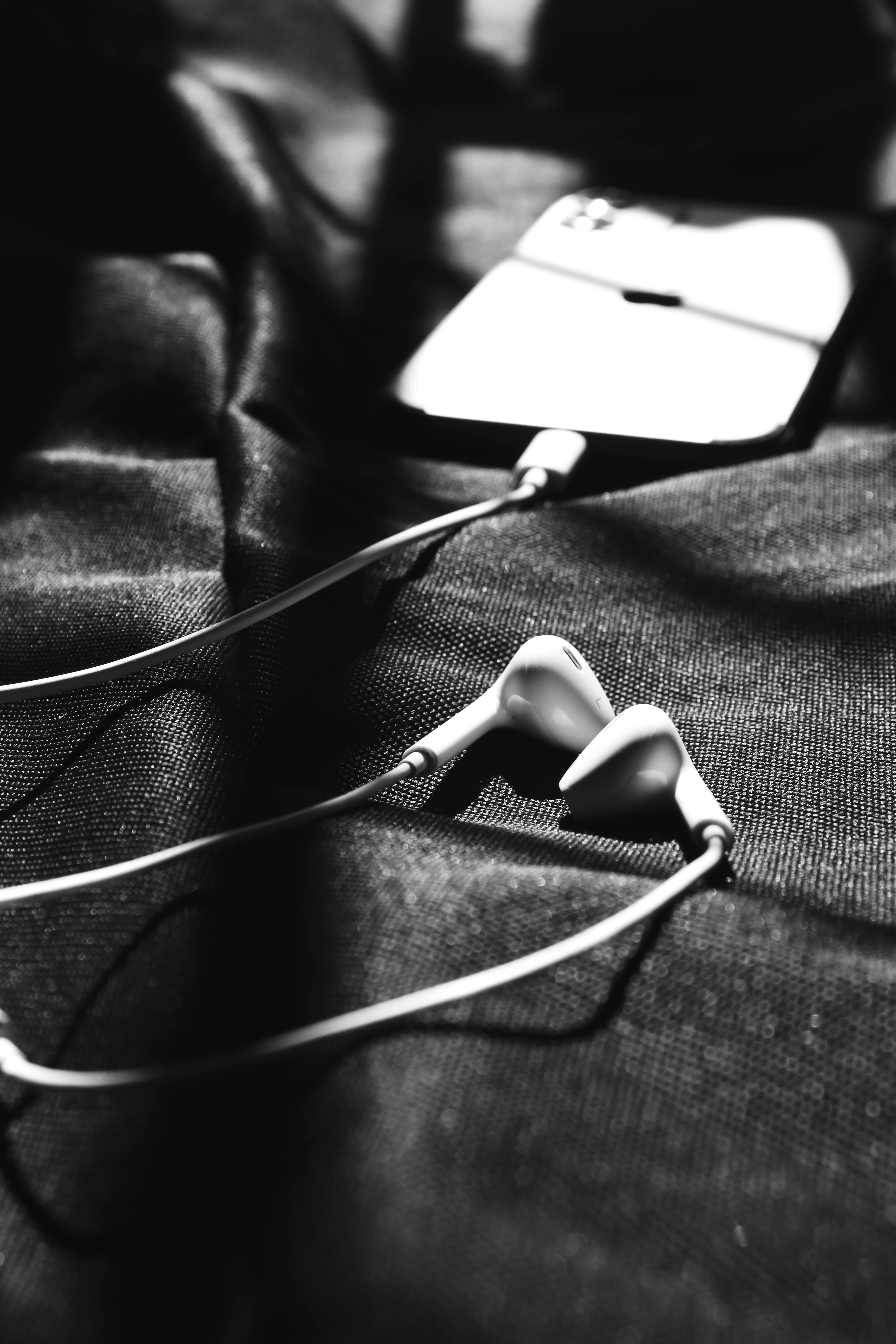 Black headphones with mobile smartphone · Free Stock Photo