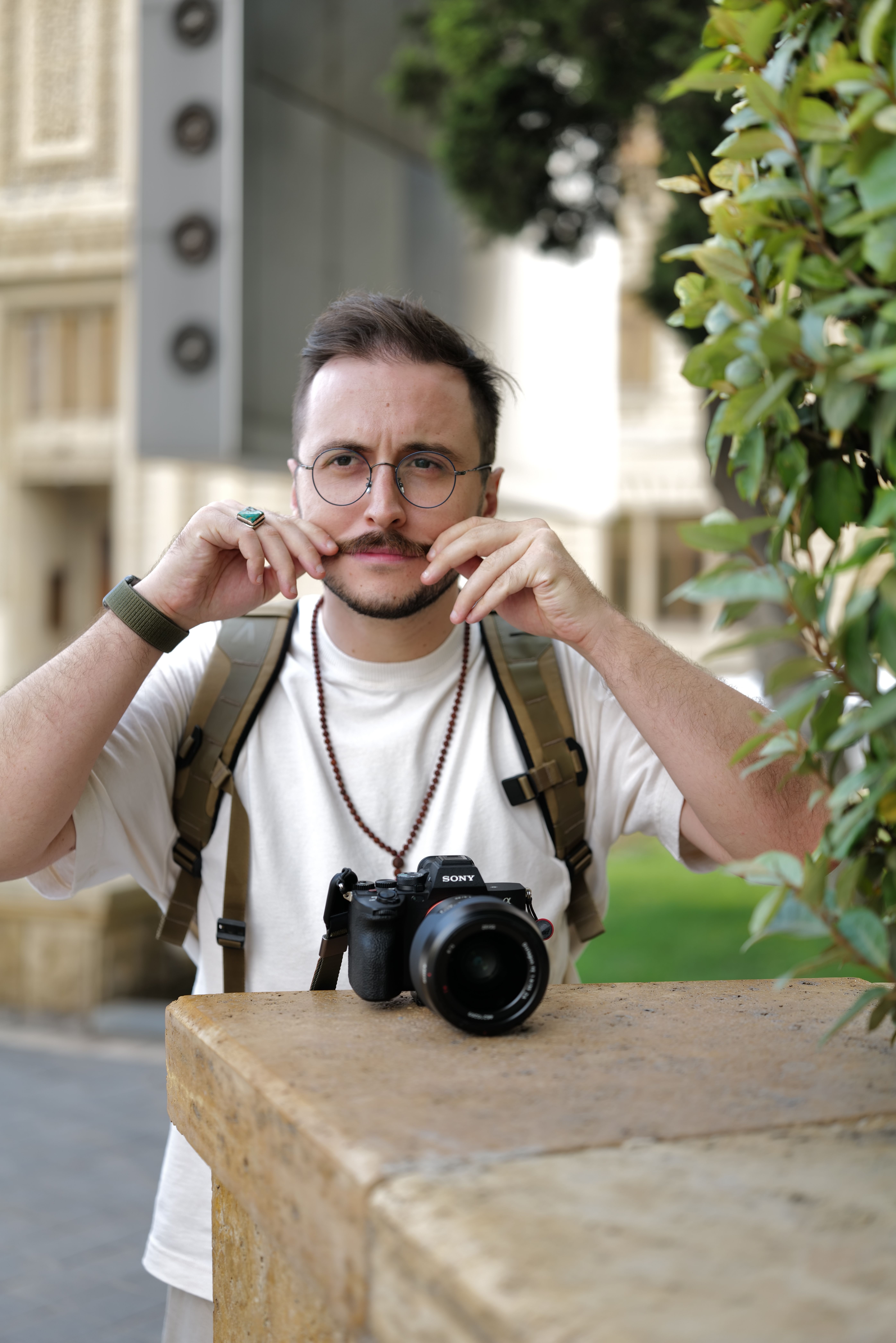 Photographer Curling His Mustache and the Camera is Lying on the Wall ...