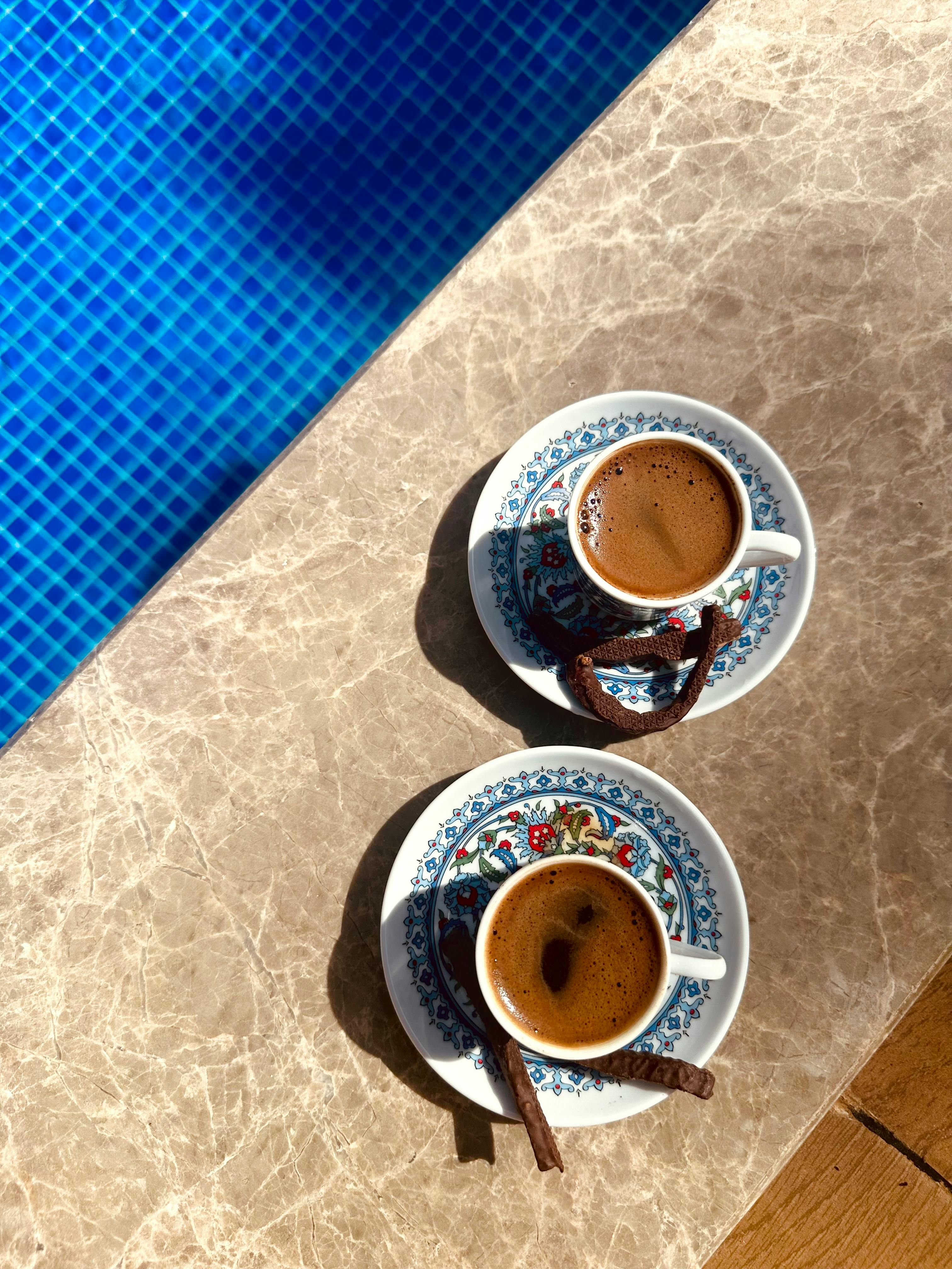 Two Coffee Cups by a Swimming Pool · Free Stock Photo