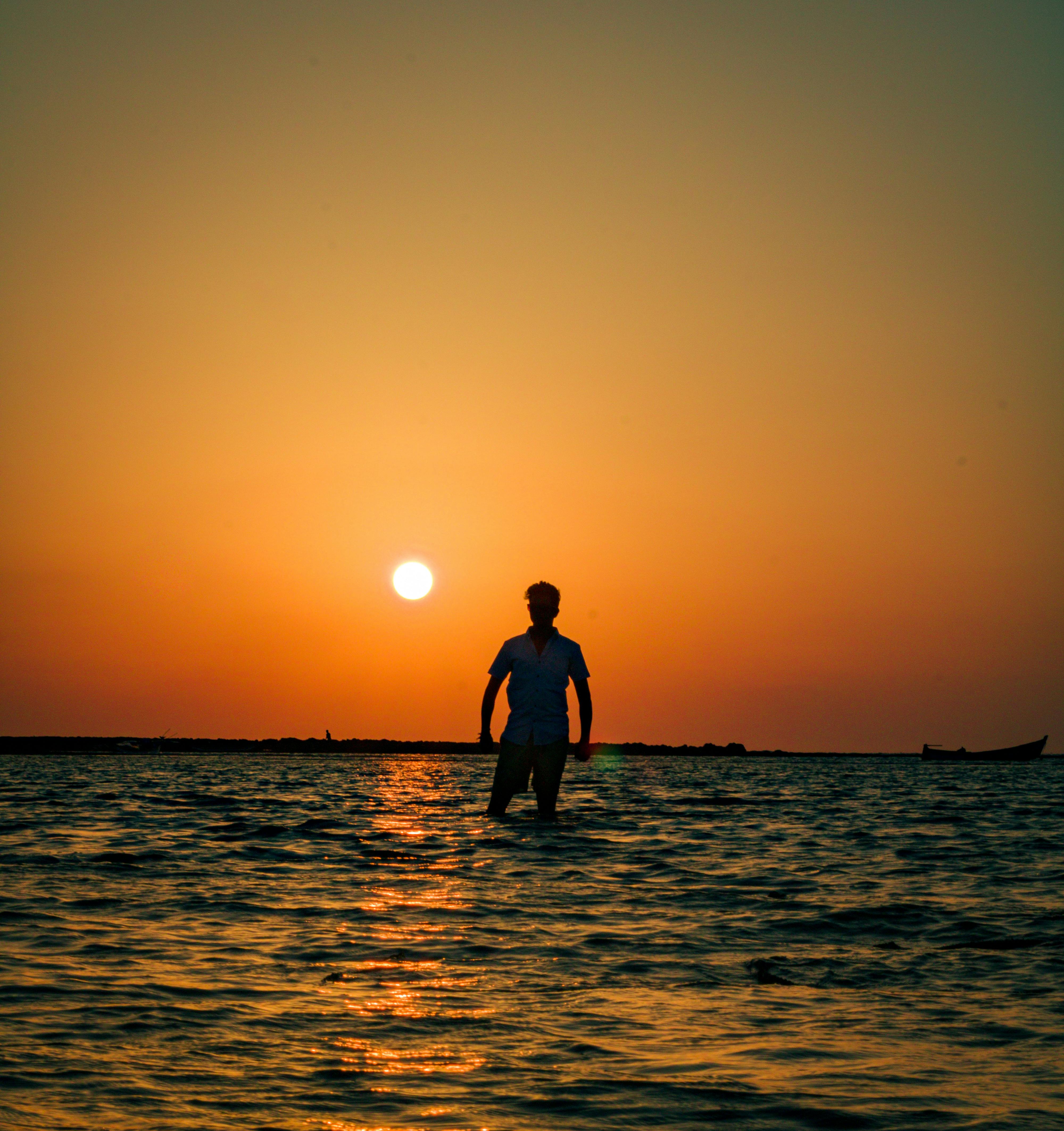 Man on Sea Shore at Sunset · Free Stock Photo