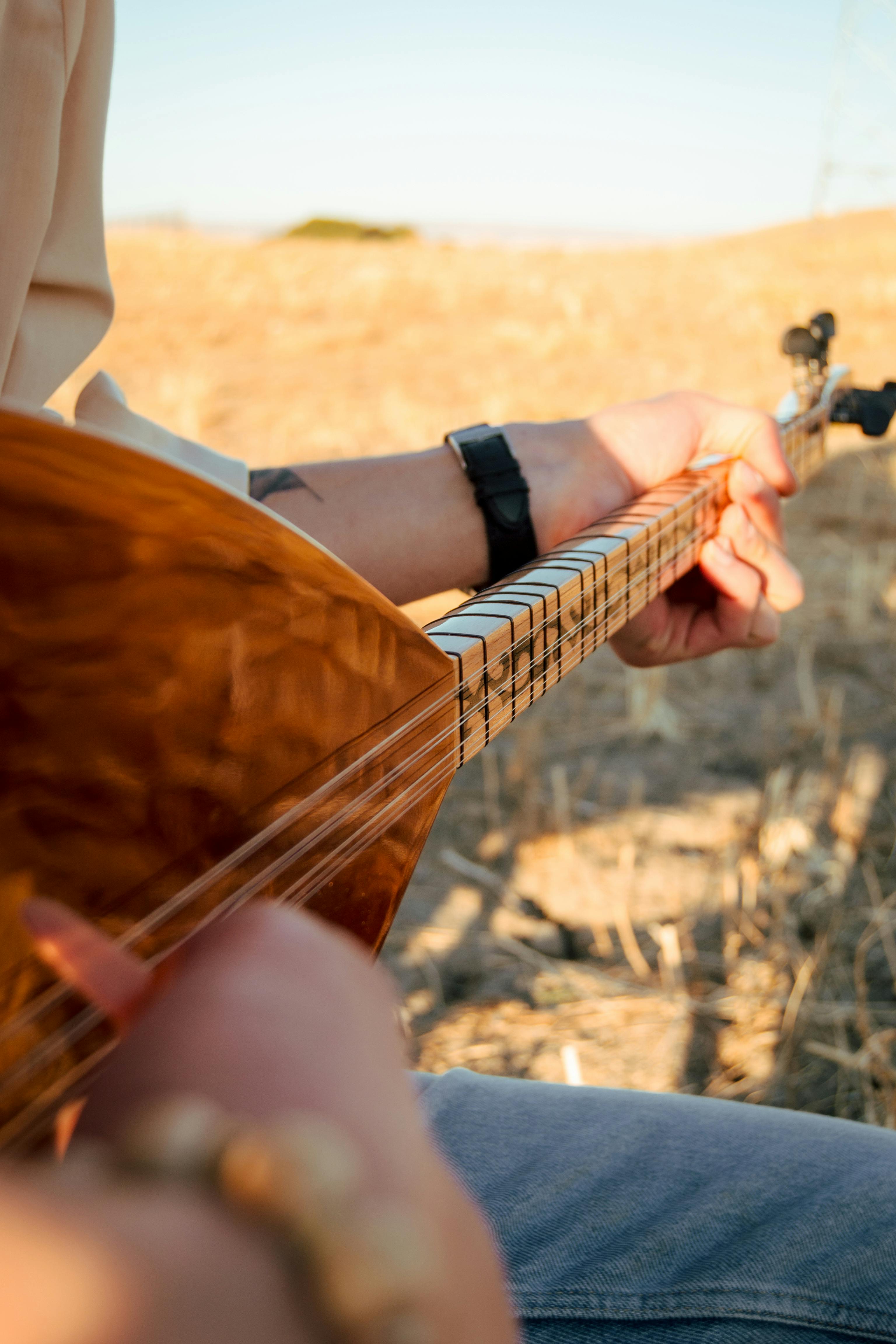 Person Playing on Baglama · Free Stock Photo