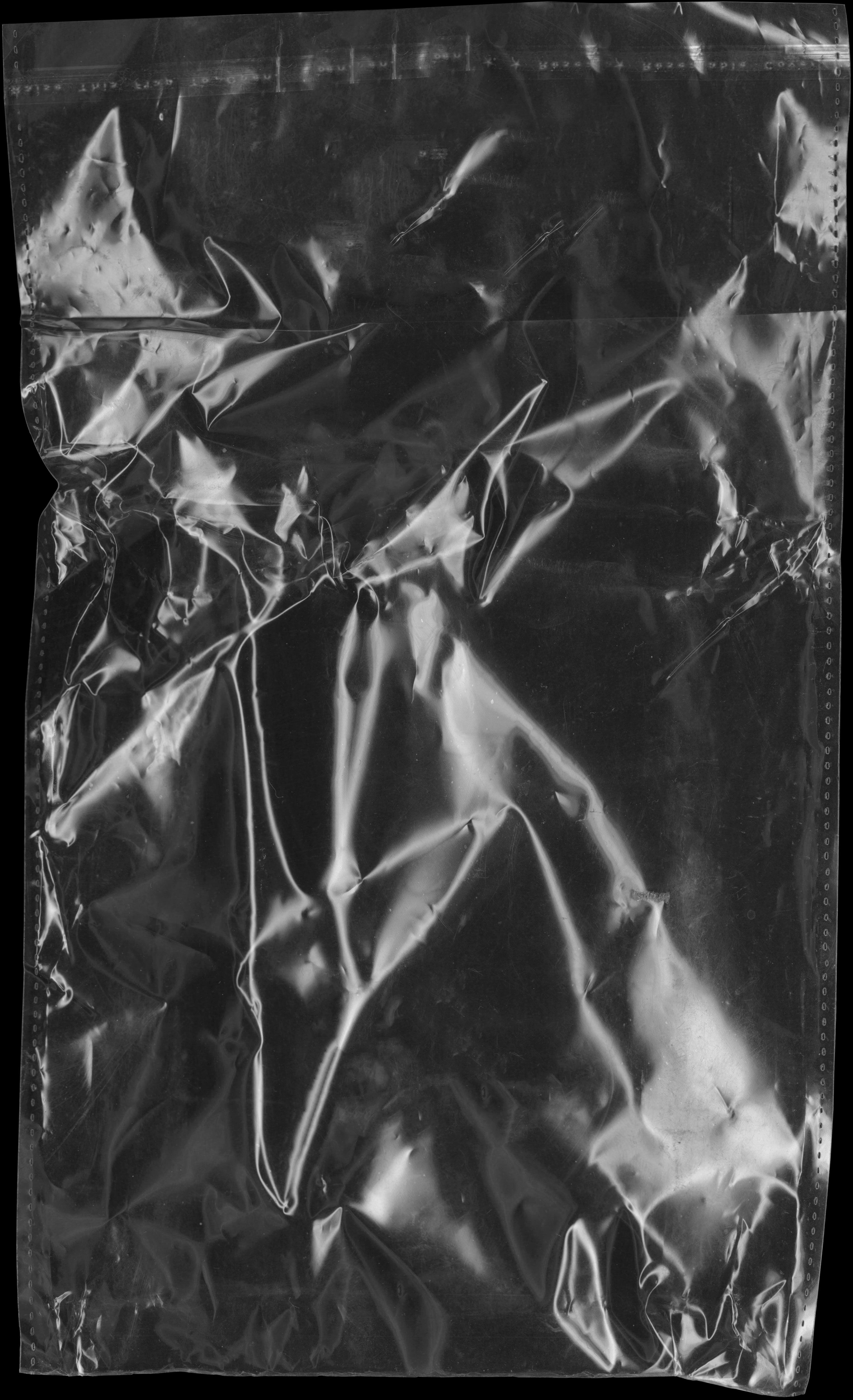 Abstract Close-up of Crumpled Plastic Wrap · Free Stock Photo