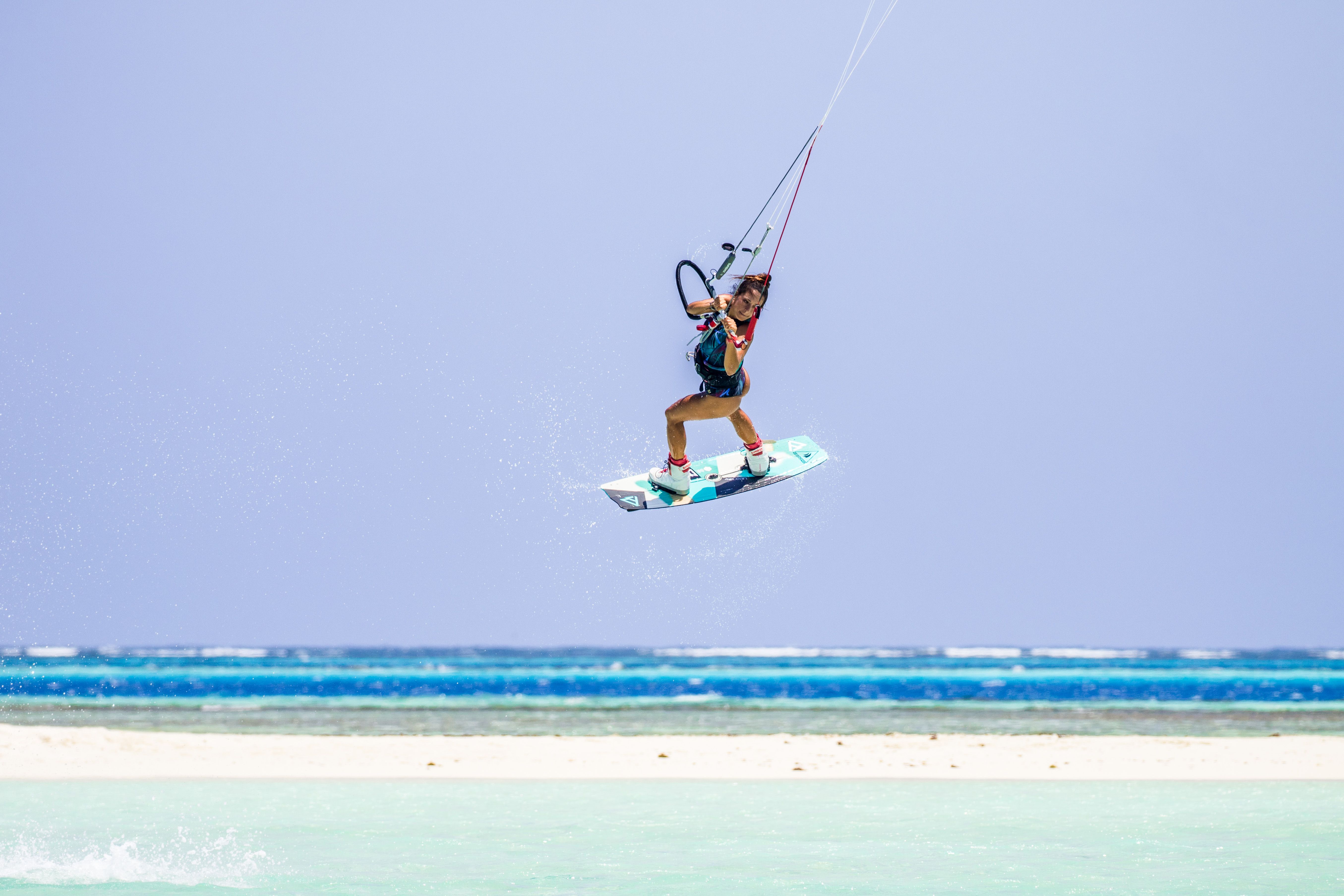 Woman Flying on a Kite Board over Sea Surface · Free Stock Photo