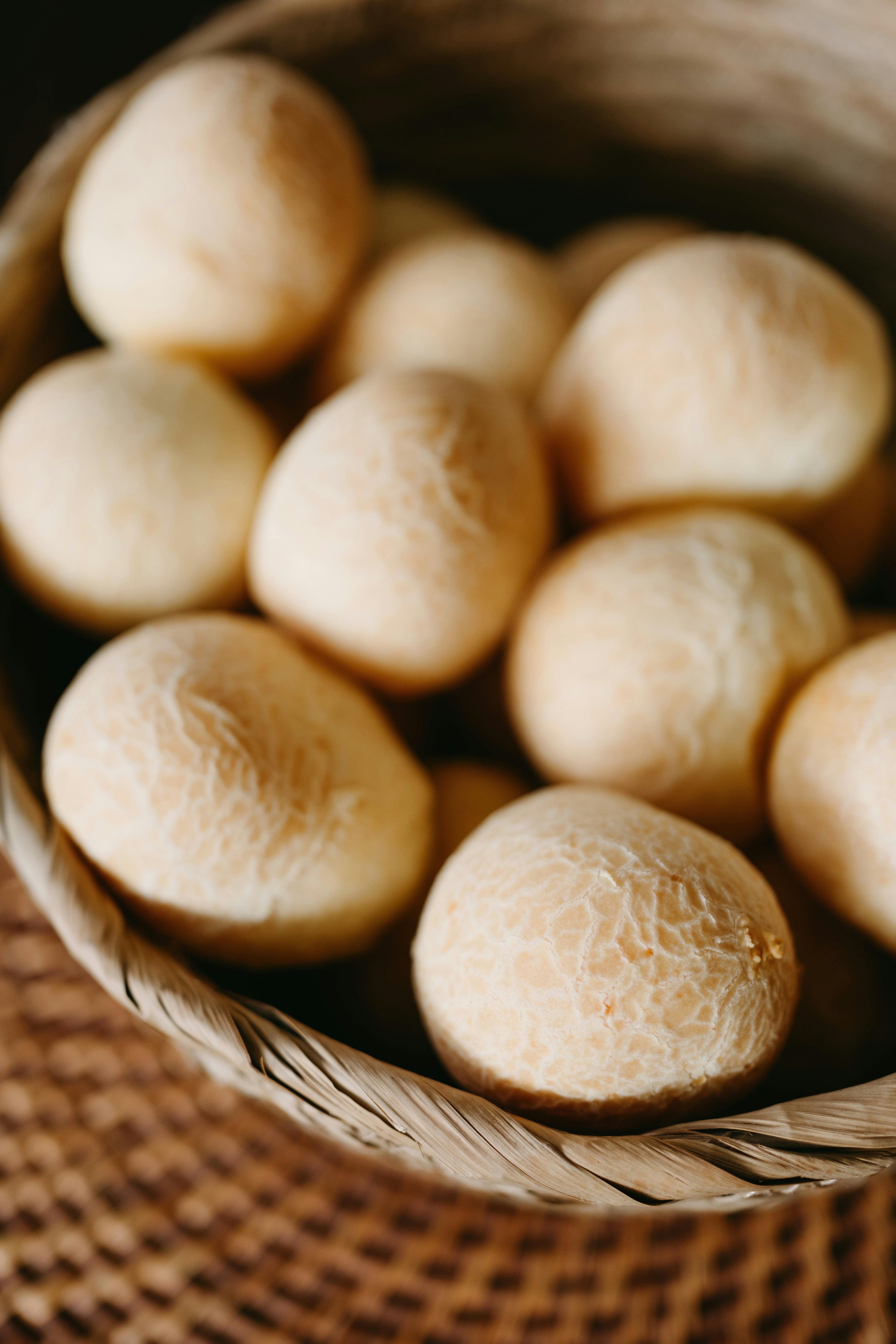 Basket of Fresh Pandebono on a Table · Free Stock Photo
