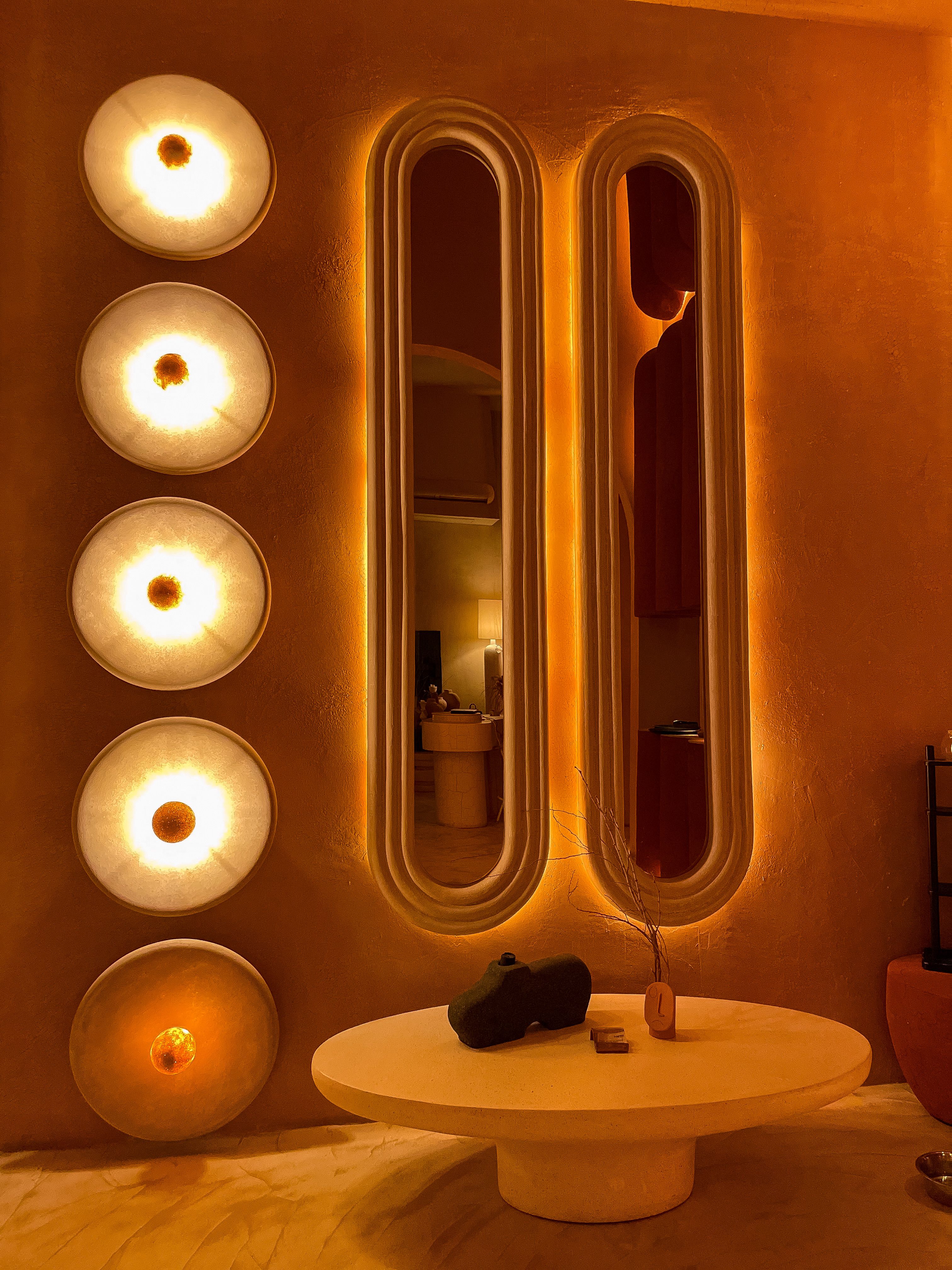 Decorative Backlit Mirrors Next to Wall Lamps · Free Stock Photo
