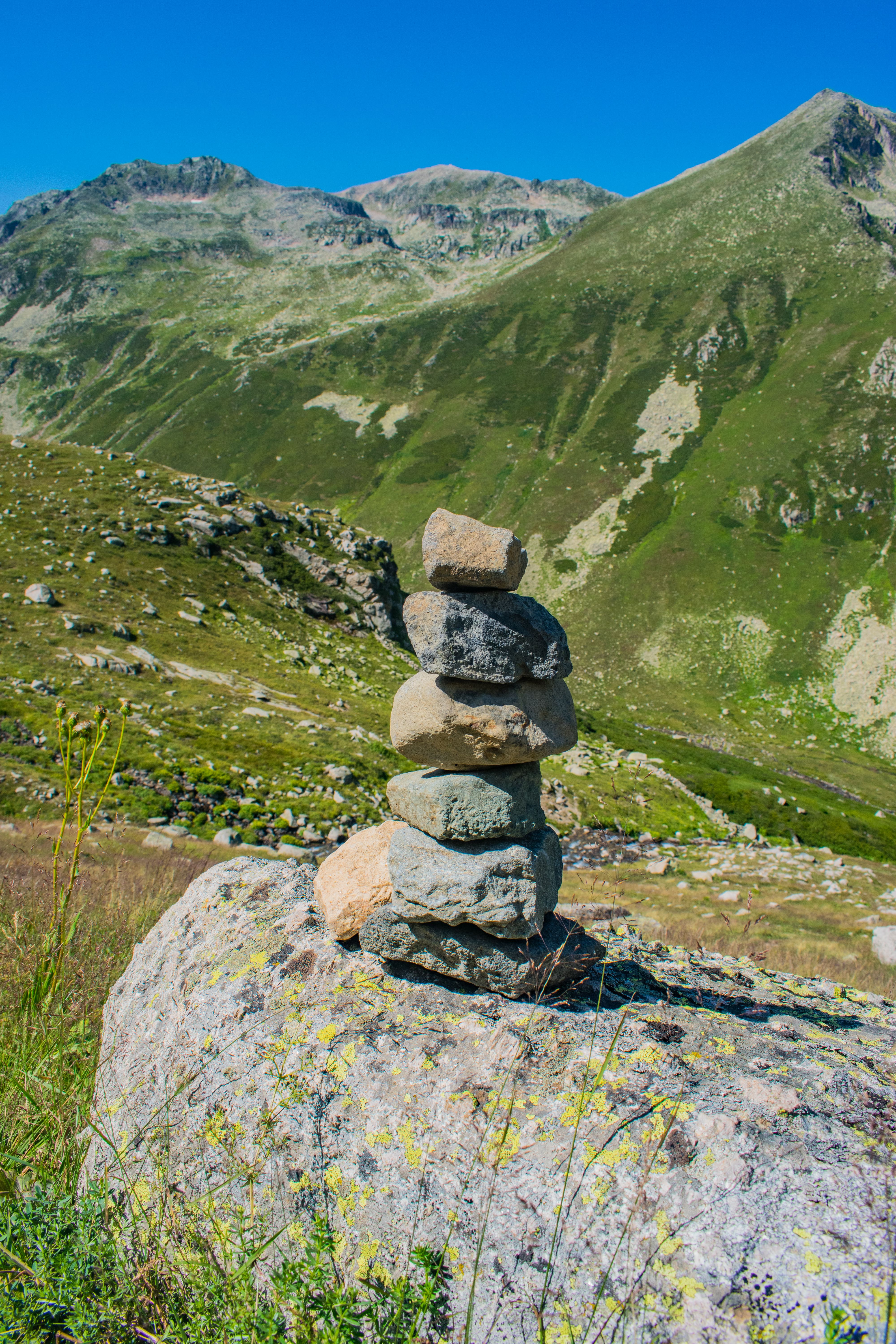 Stack of Stones on a Rock on a Mountainside · Free Stock Photo