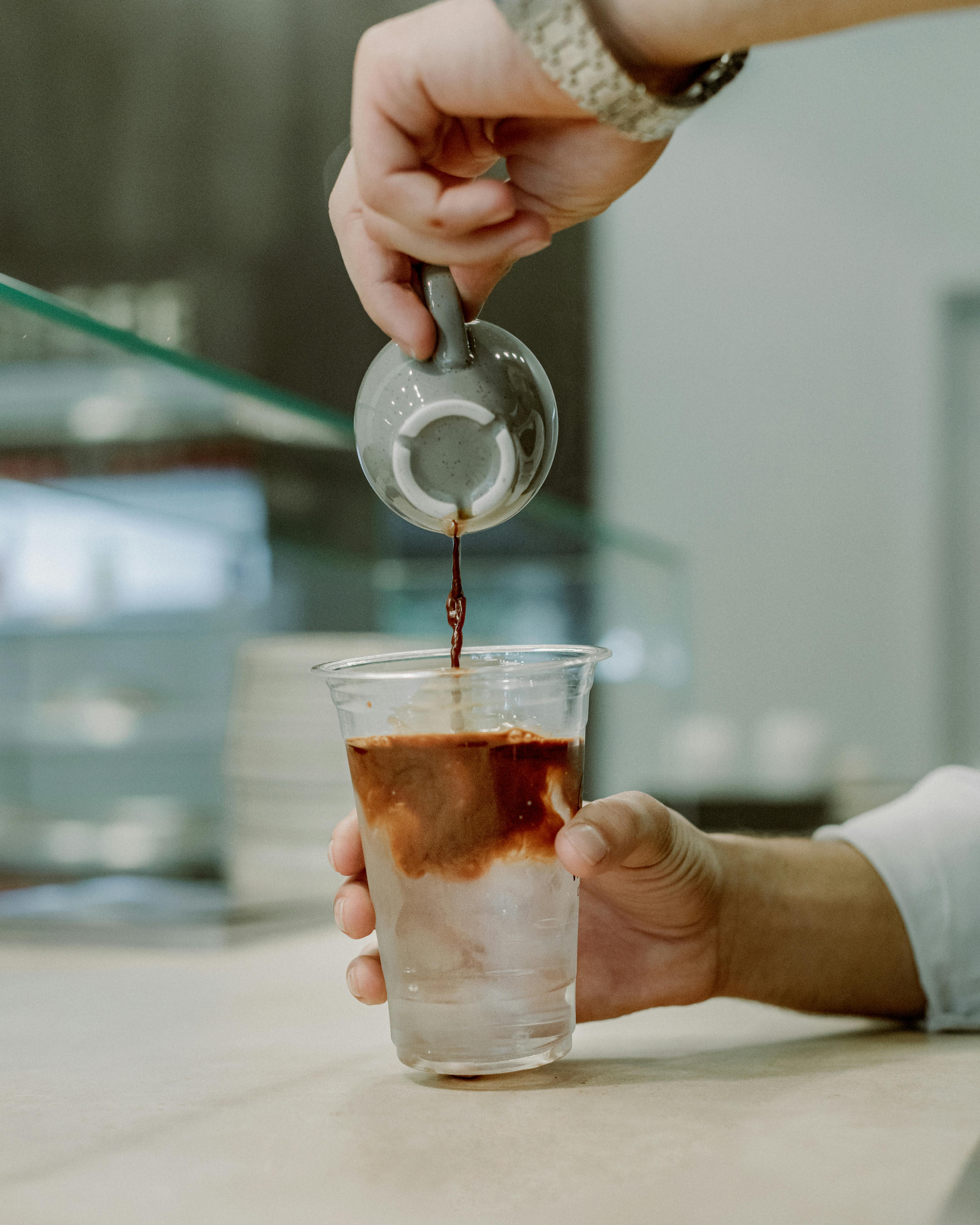 Barista Making Iced Coffee with Cold Water Extraction · Free Stock Photo