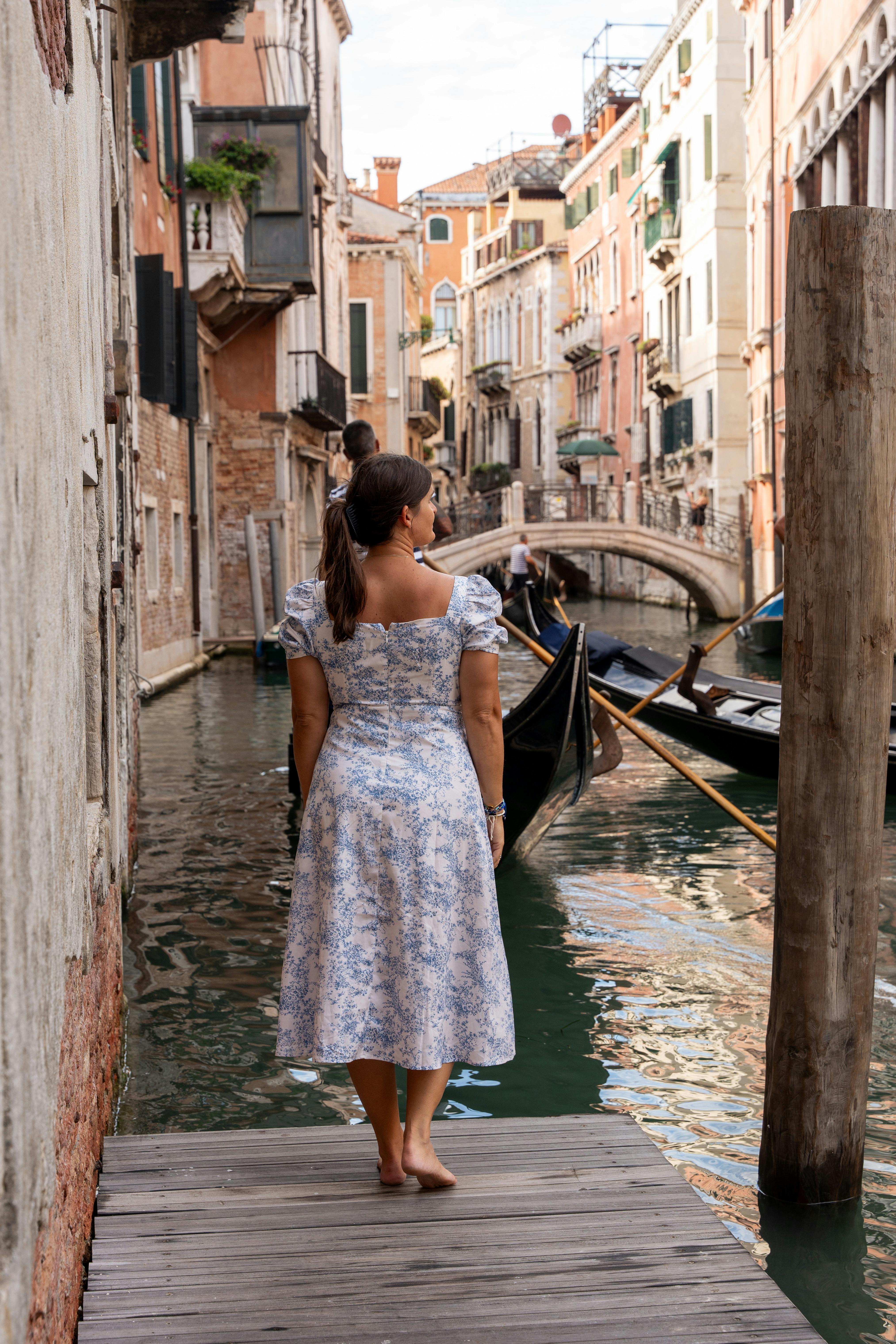 Woman in Dress on Wooden Platform in Venice · Free Stock Photo