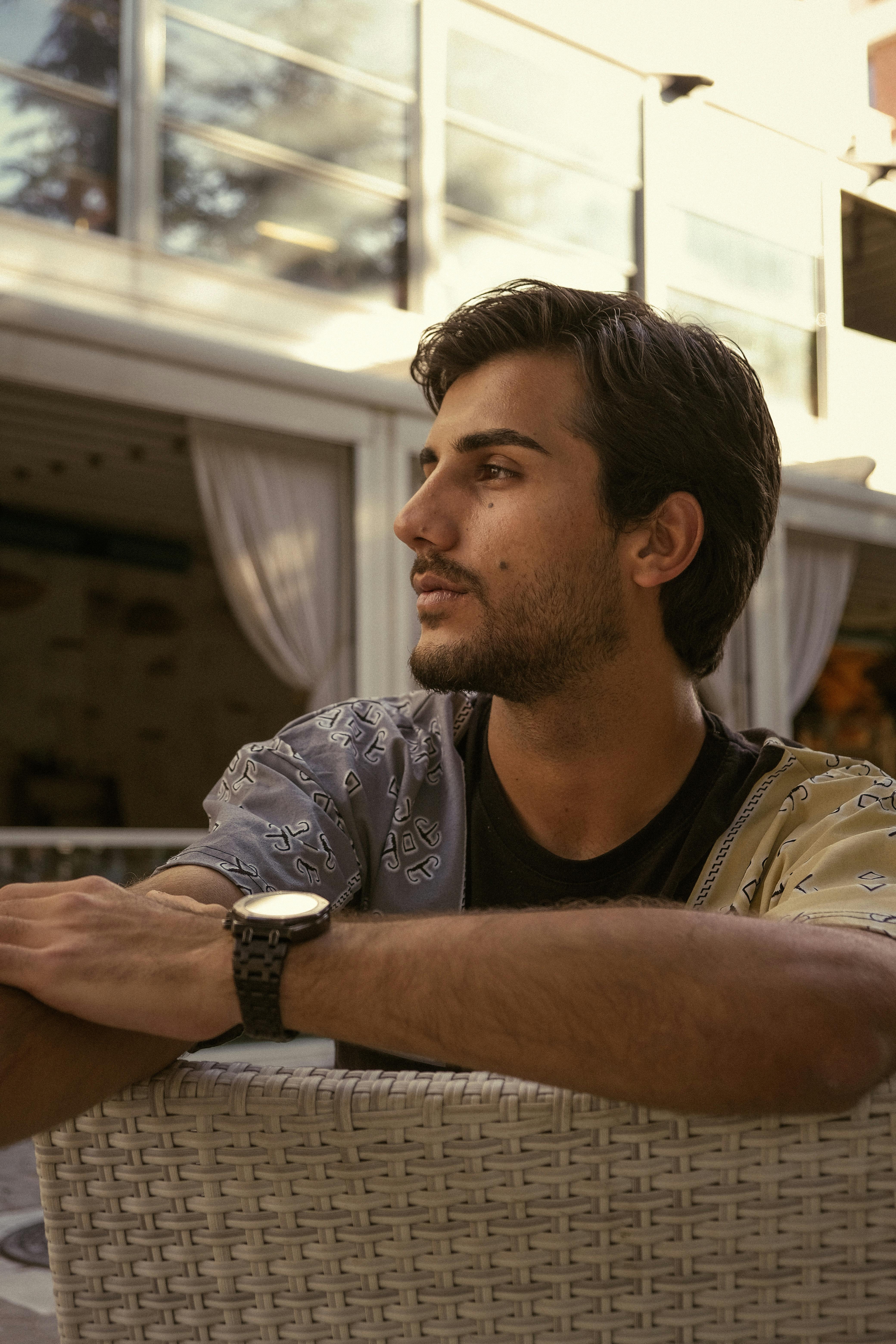 Man Resting Arm against Chair · Free Stock Photo