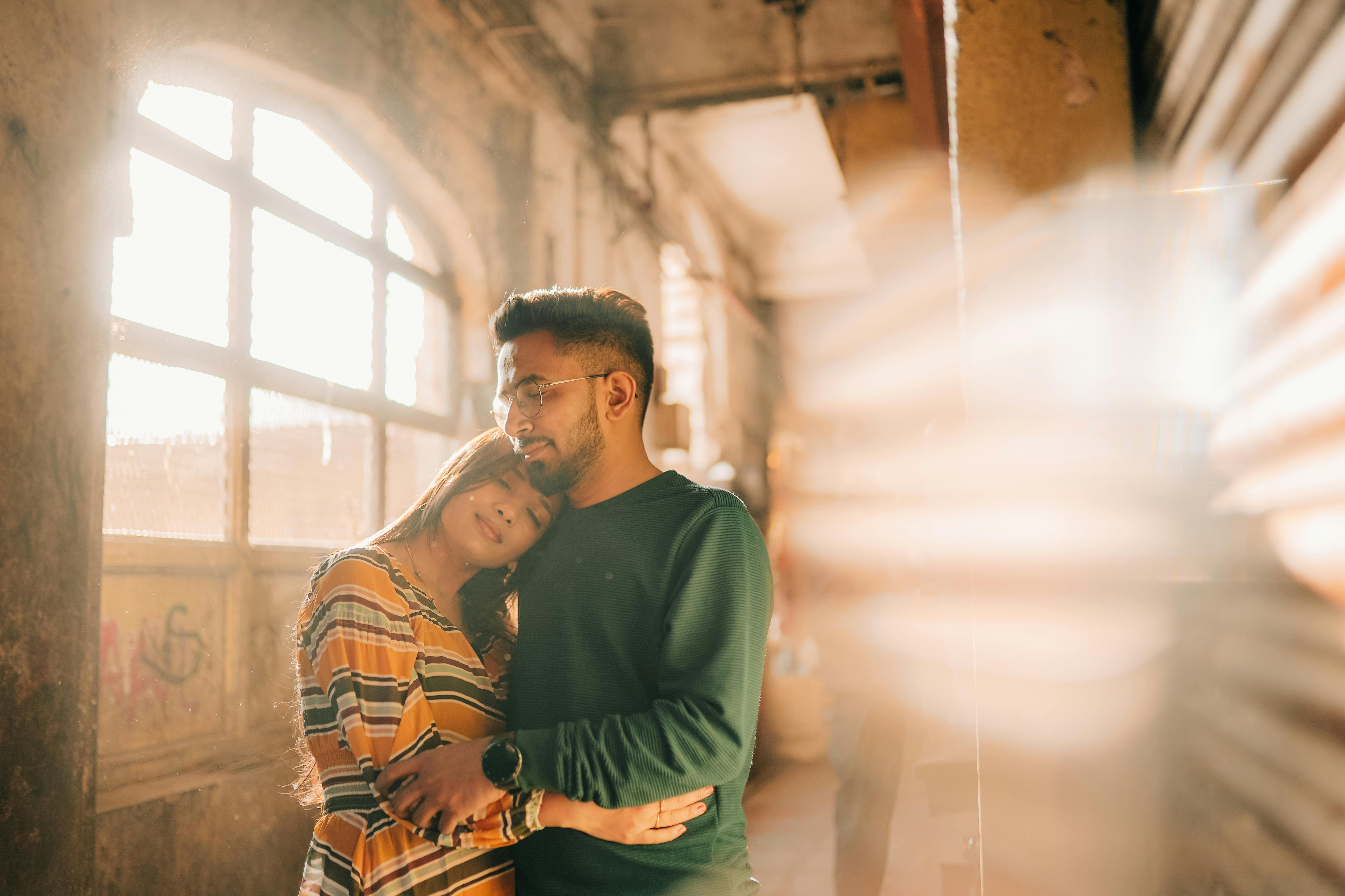 Sunlight over Hugging Couple · Free Stock Photo