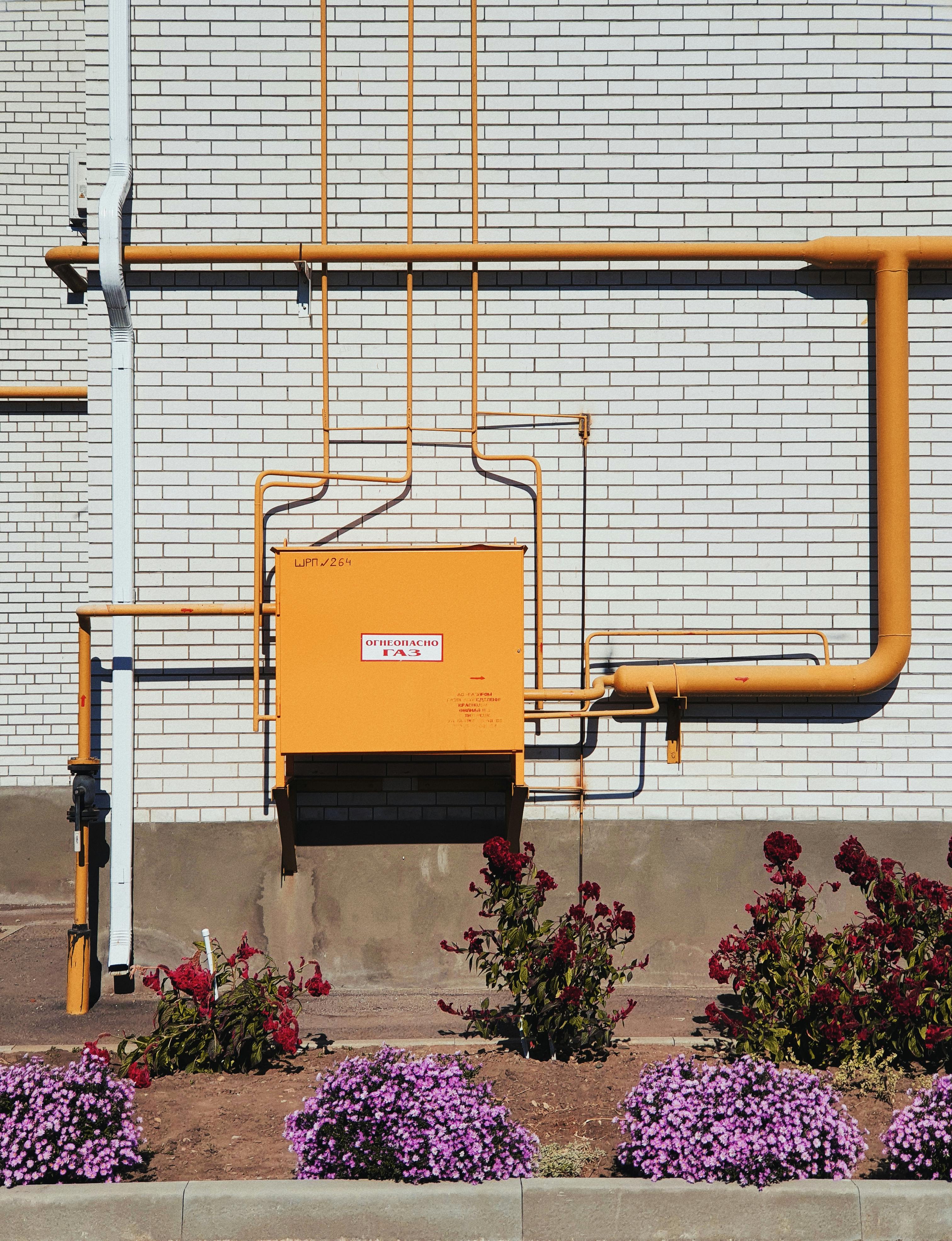 Electricity Box on White Wall · Free Stock Photo