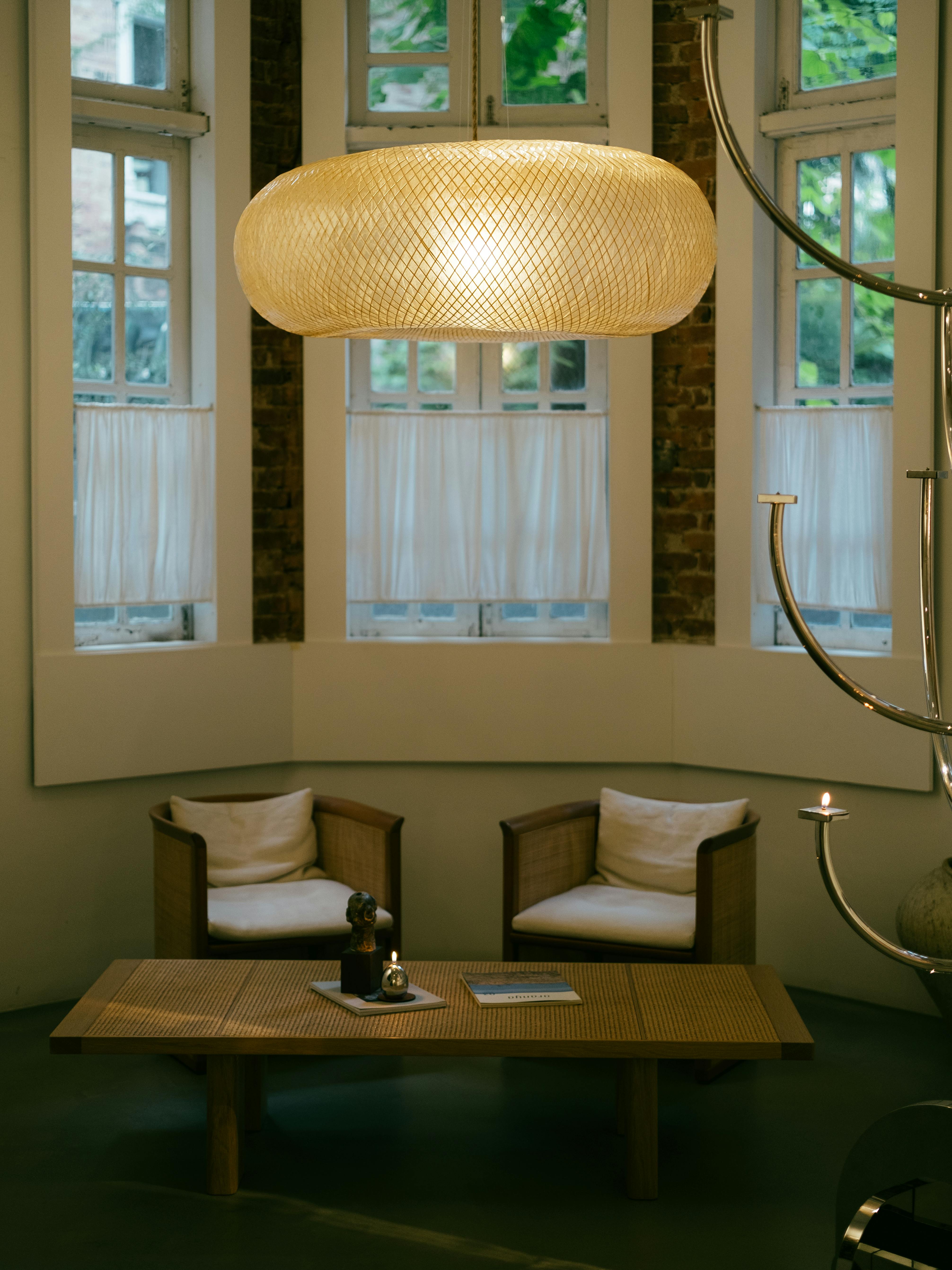 A large round lamp hanging from the ceiling · Free Stock Photo