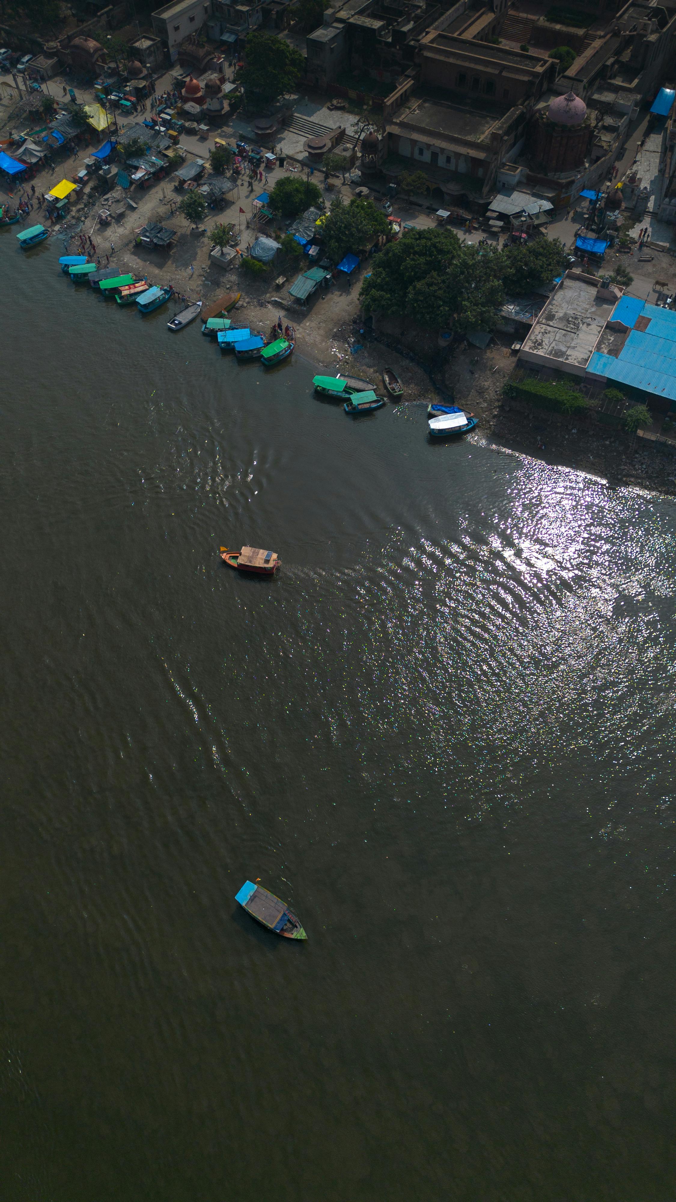 An aerial view of a river with boats in it · Free Stock Photo