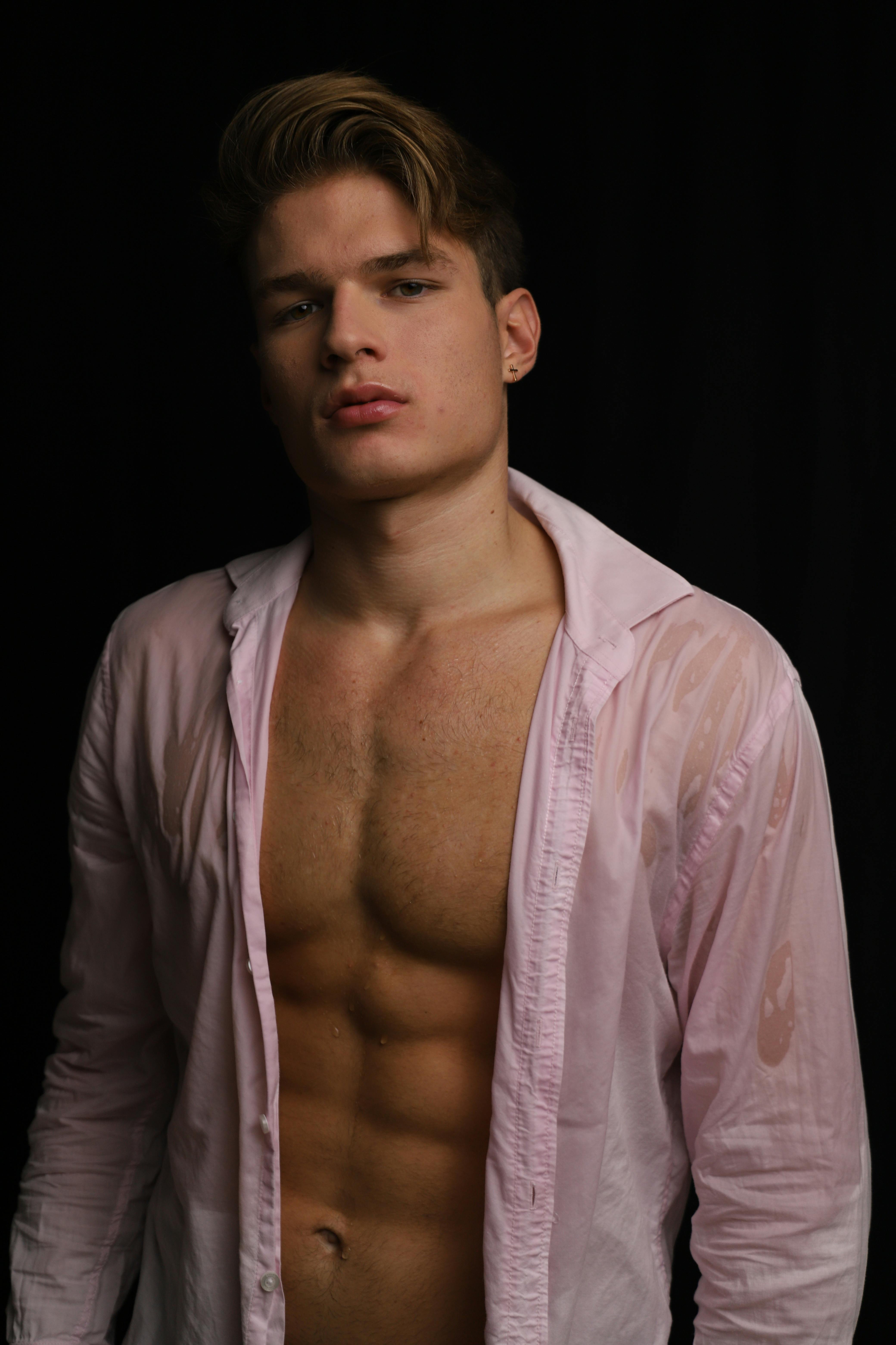 Portrait of Blonde Man Wearing Pink Shirt · Free Stock Photo