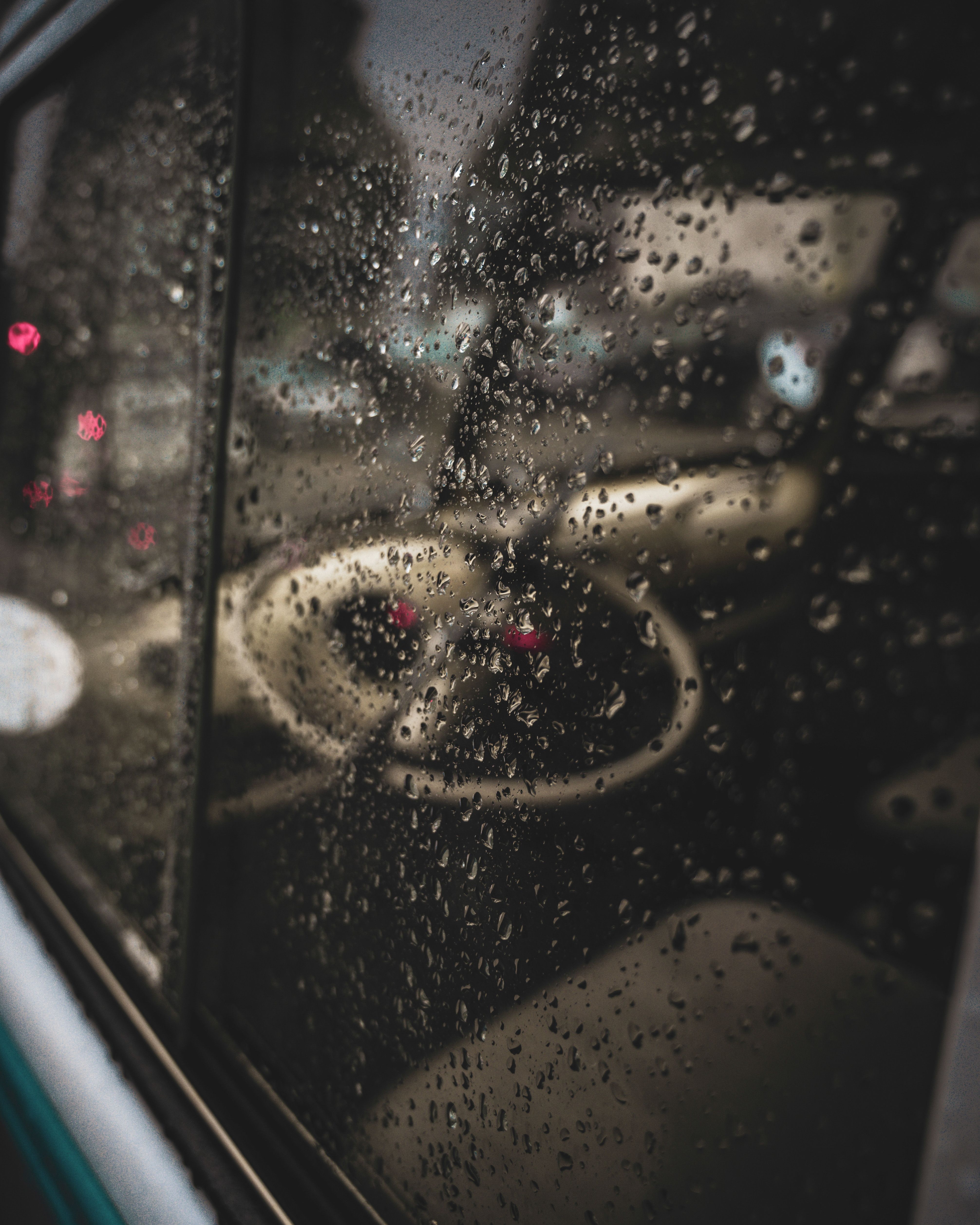 A car window with rain drops on it · Free Stock Photo