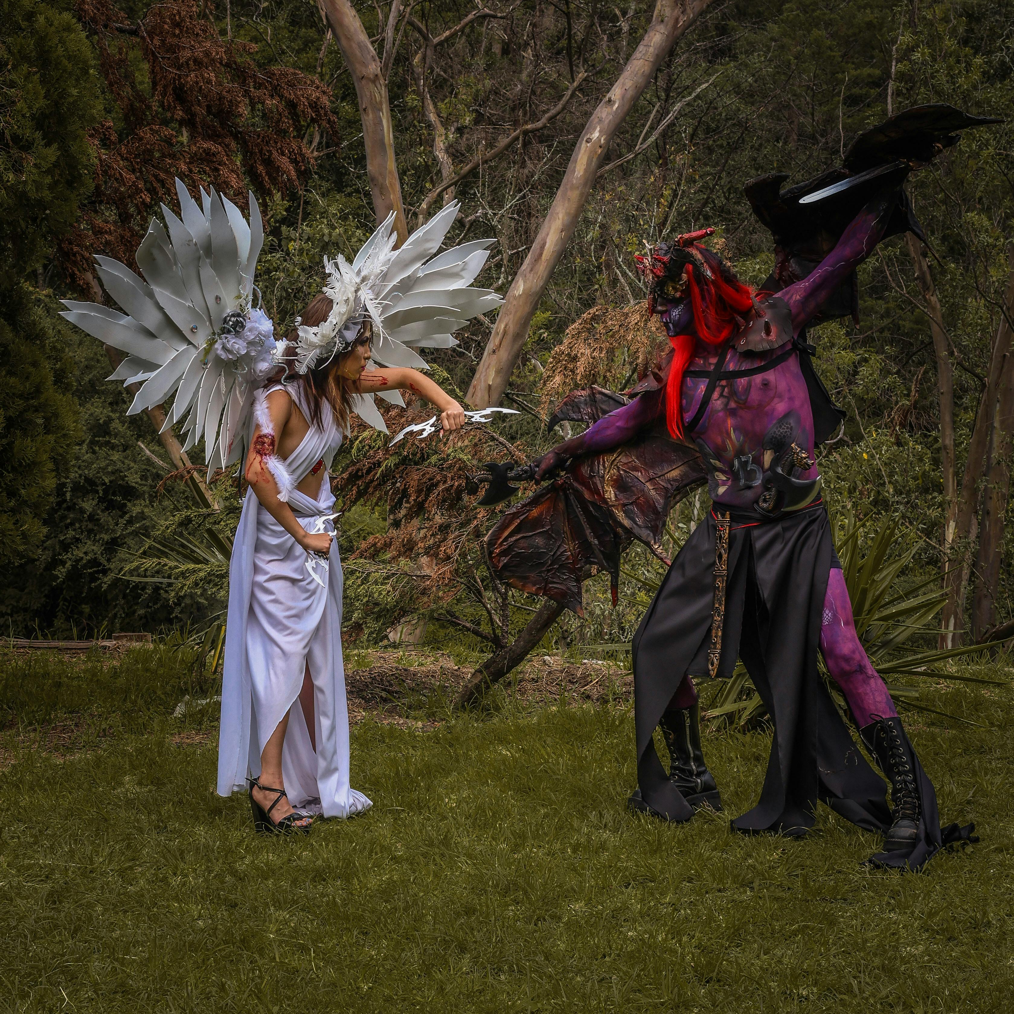 Woman and Man in Cosplay Costumes in Forest · Free Stock Photo