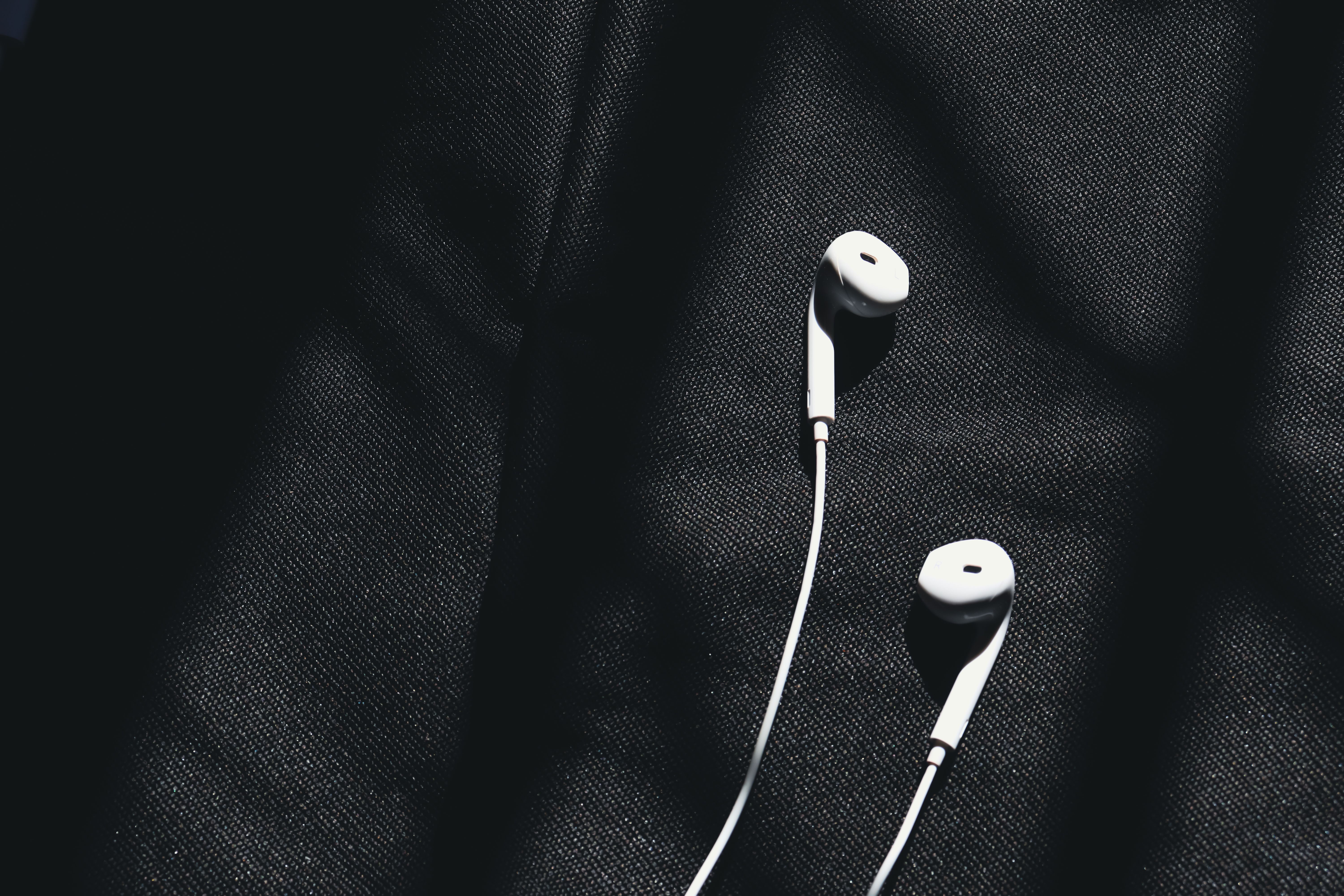 Earphones on Black Background · Free Stock Photo