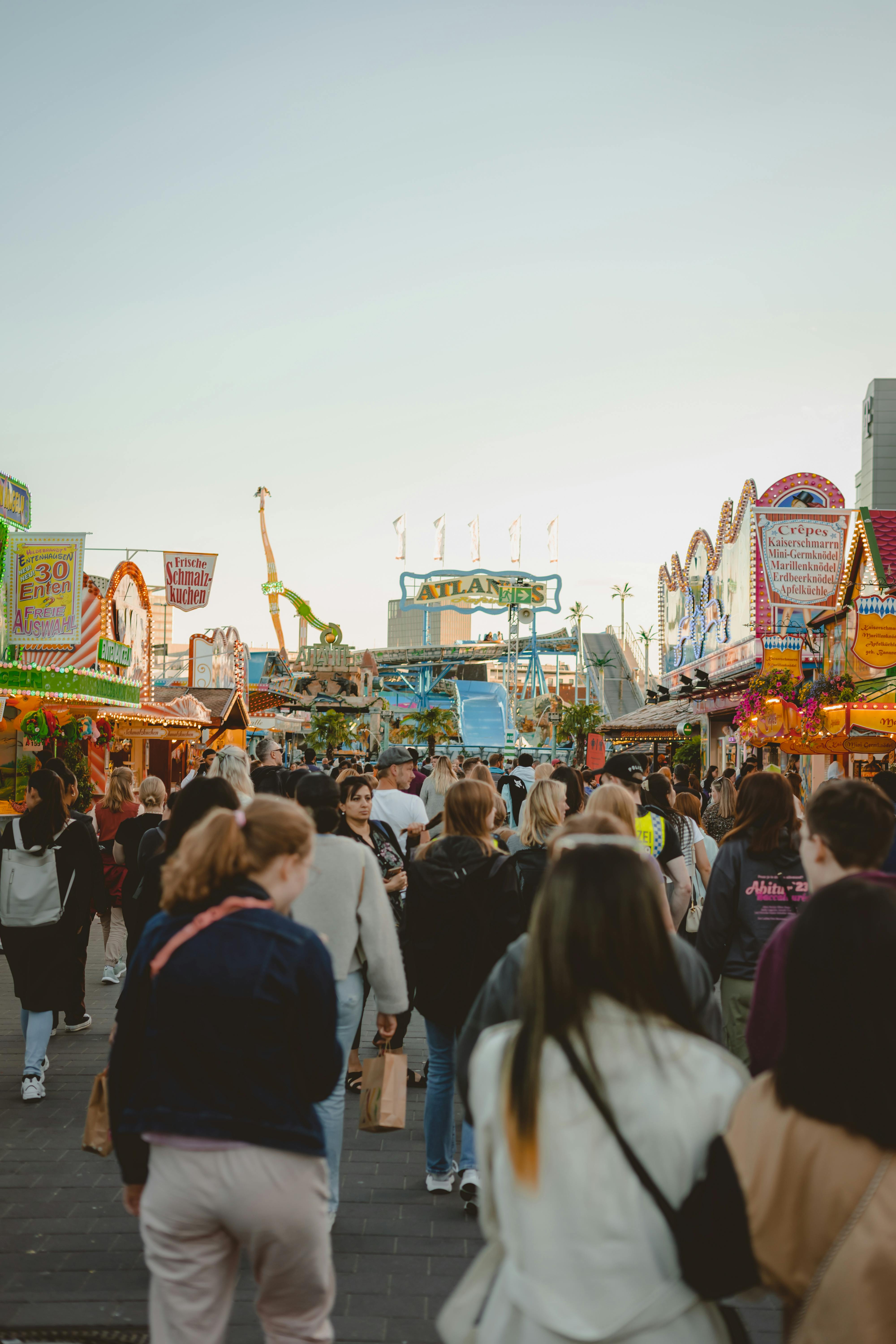 People walking through a carnival at night · Free Stock Photo
