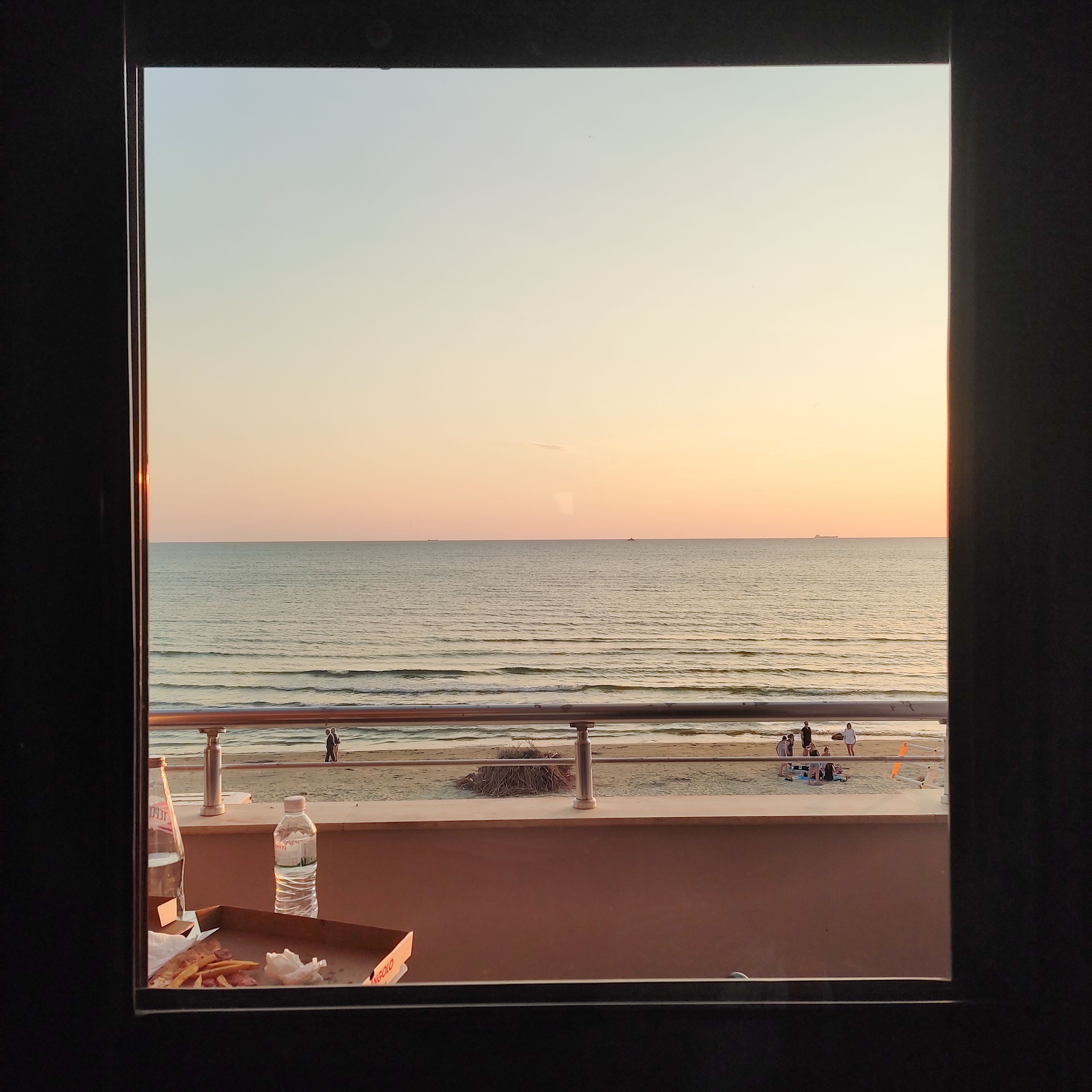 Sea Coast behind Window at Sunset · Free Stock Photo