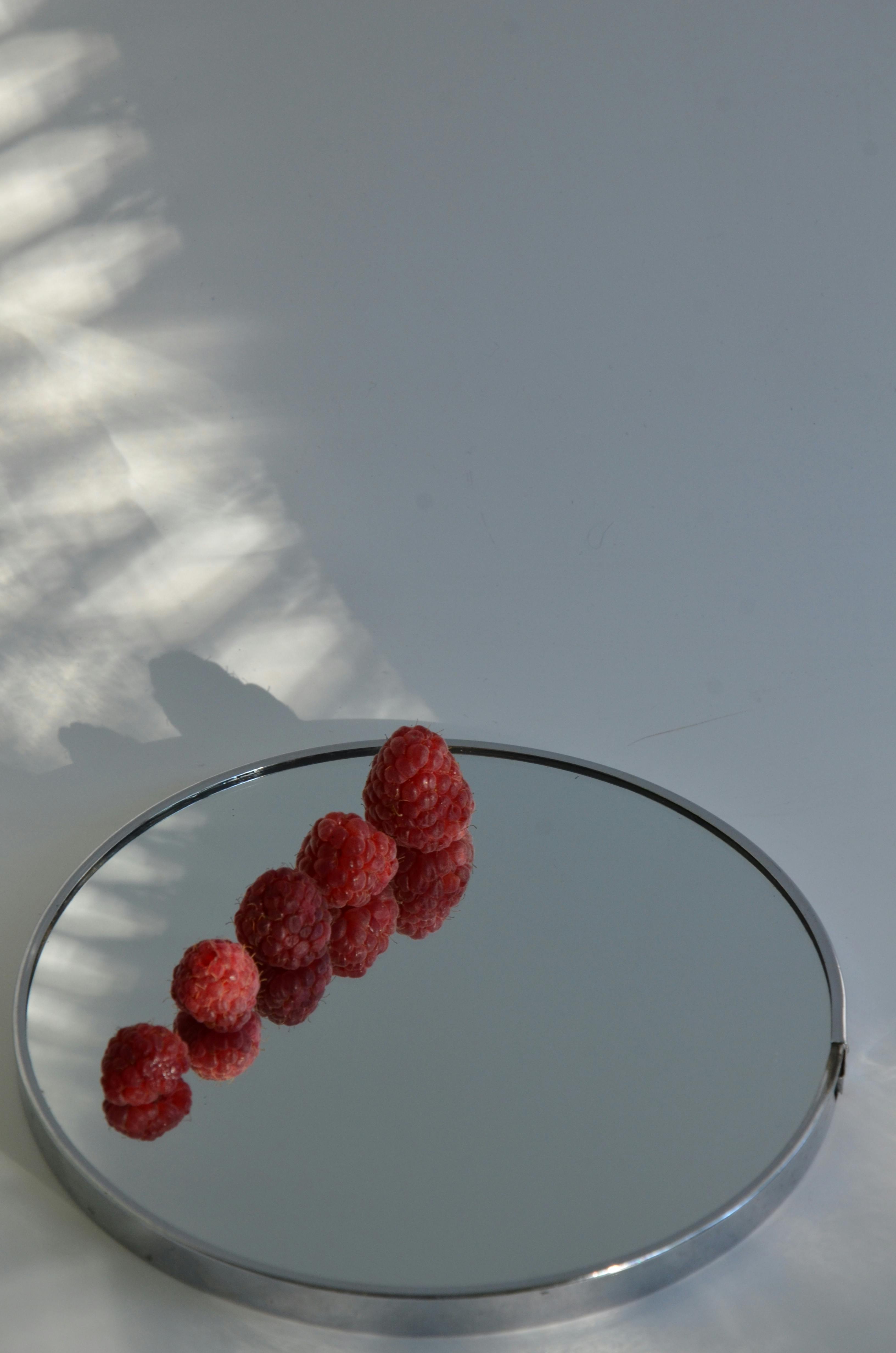 Raspberries Lying on a Mirror · Free Stock Photo