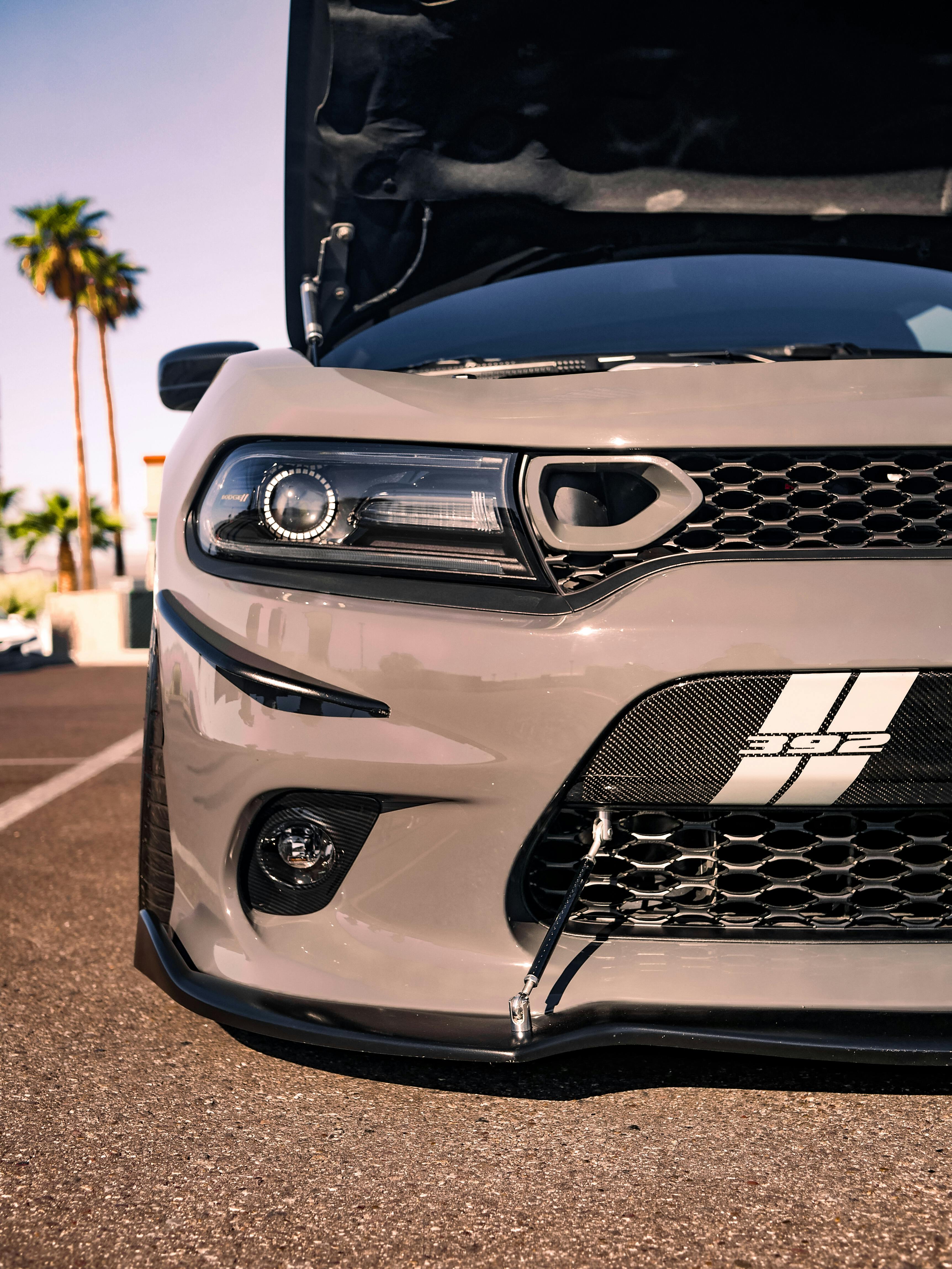 The front end of a gray dodge charger · Free Stock Photo