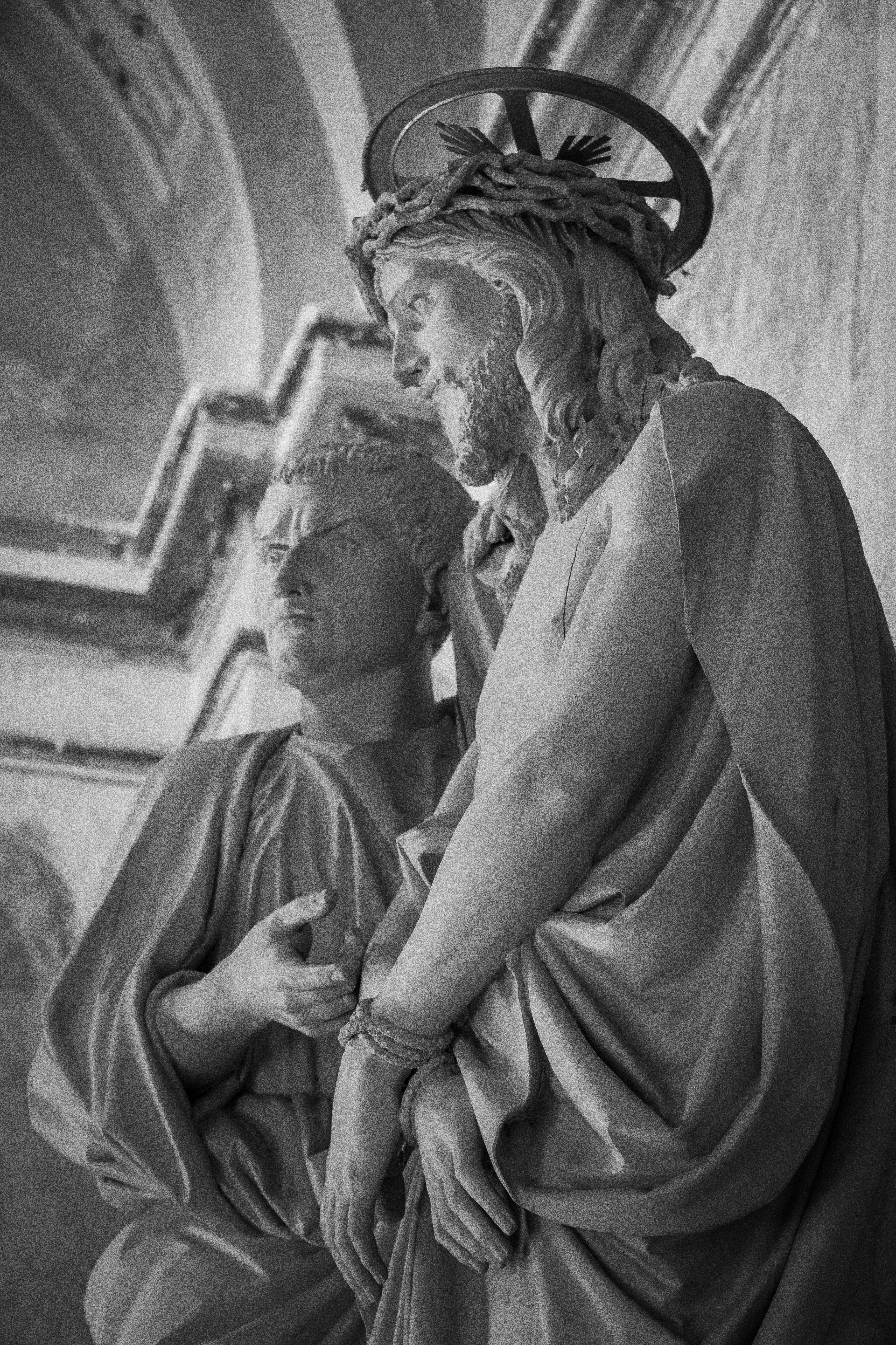 Jesus Christ Statue with Flower Arrangement · Free Stock Photo