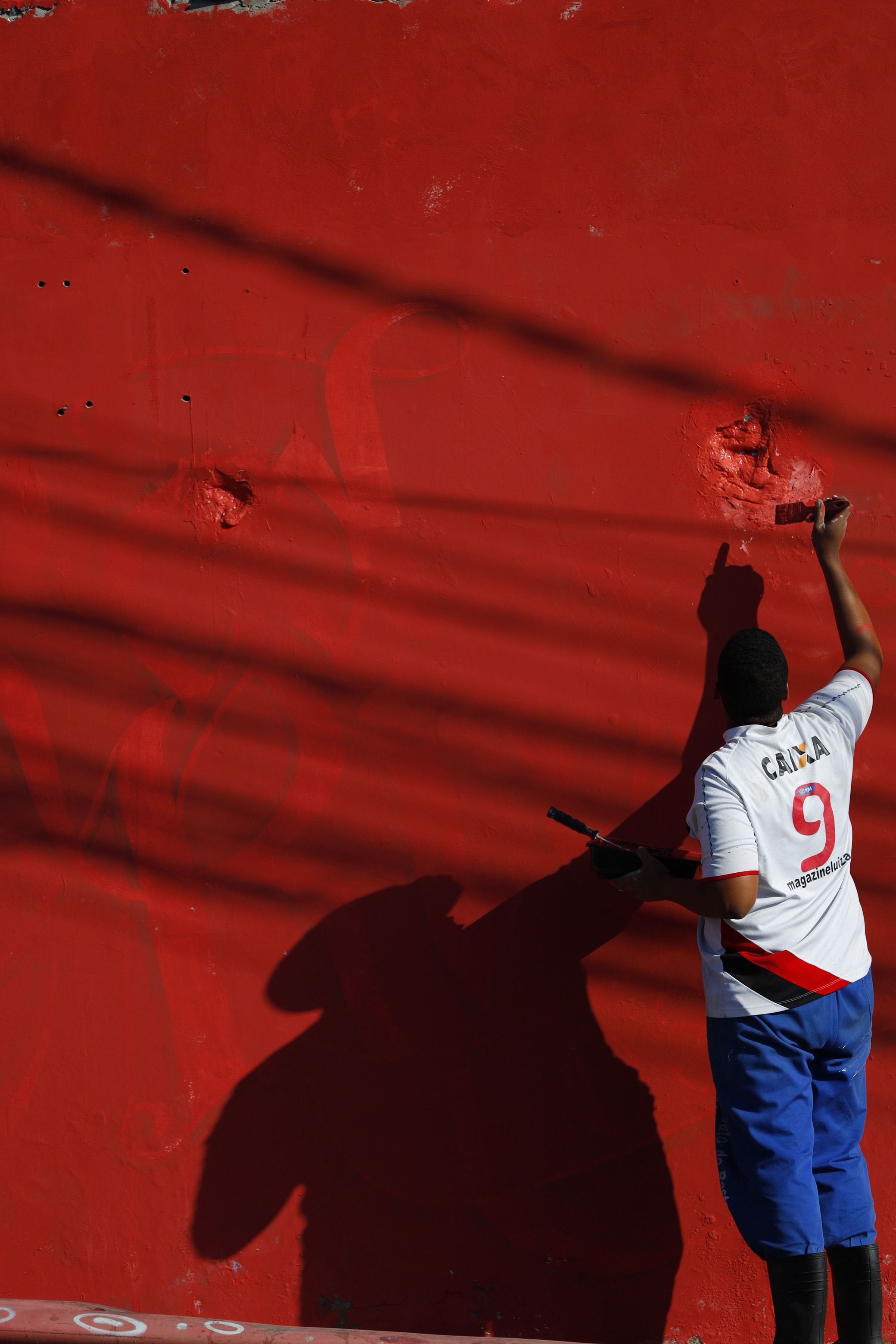 Man Painting a Wall · Free Stock Photo