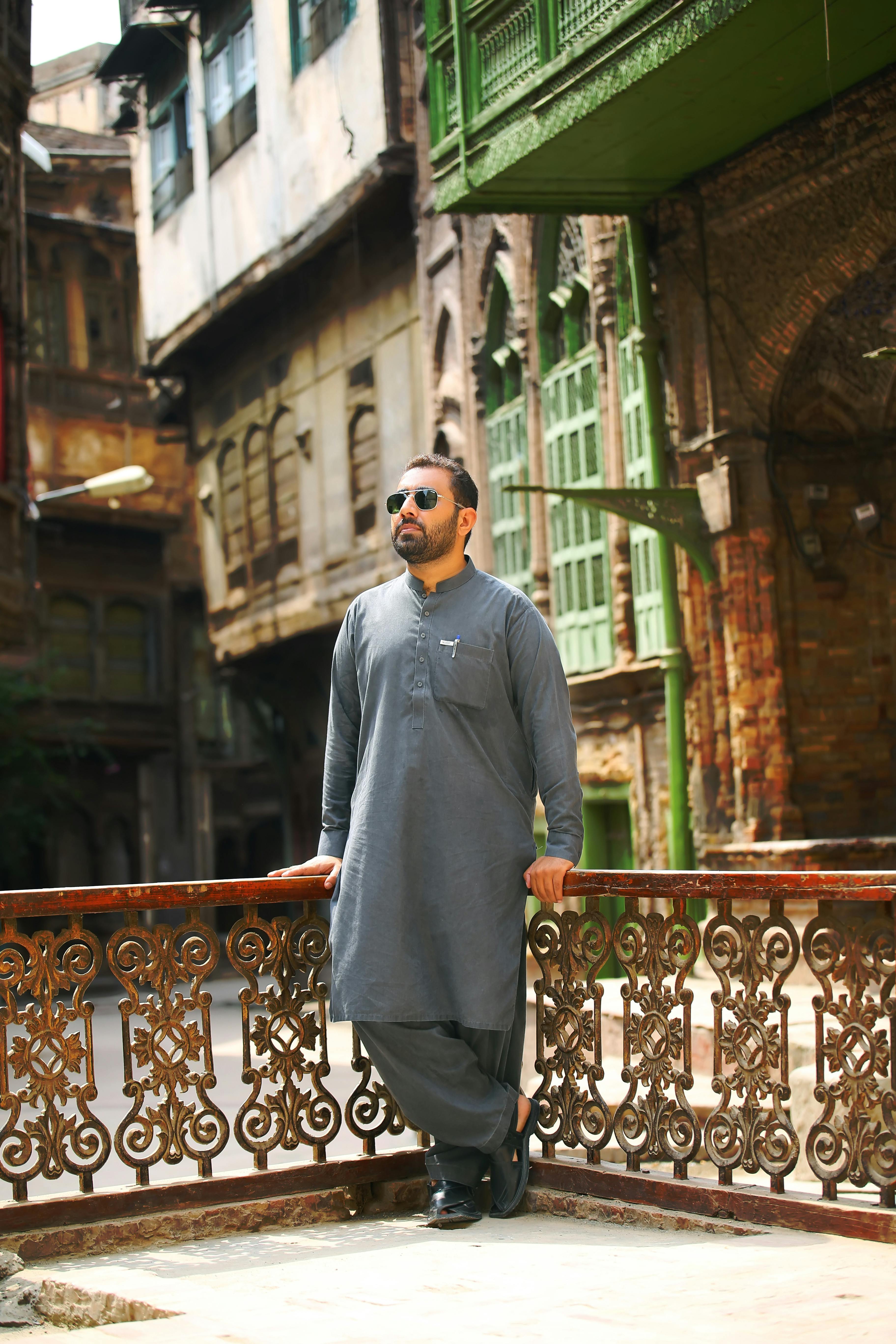 Turkish Man in Traditional Clothing Standing on a Terrace · Free Stock ...