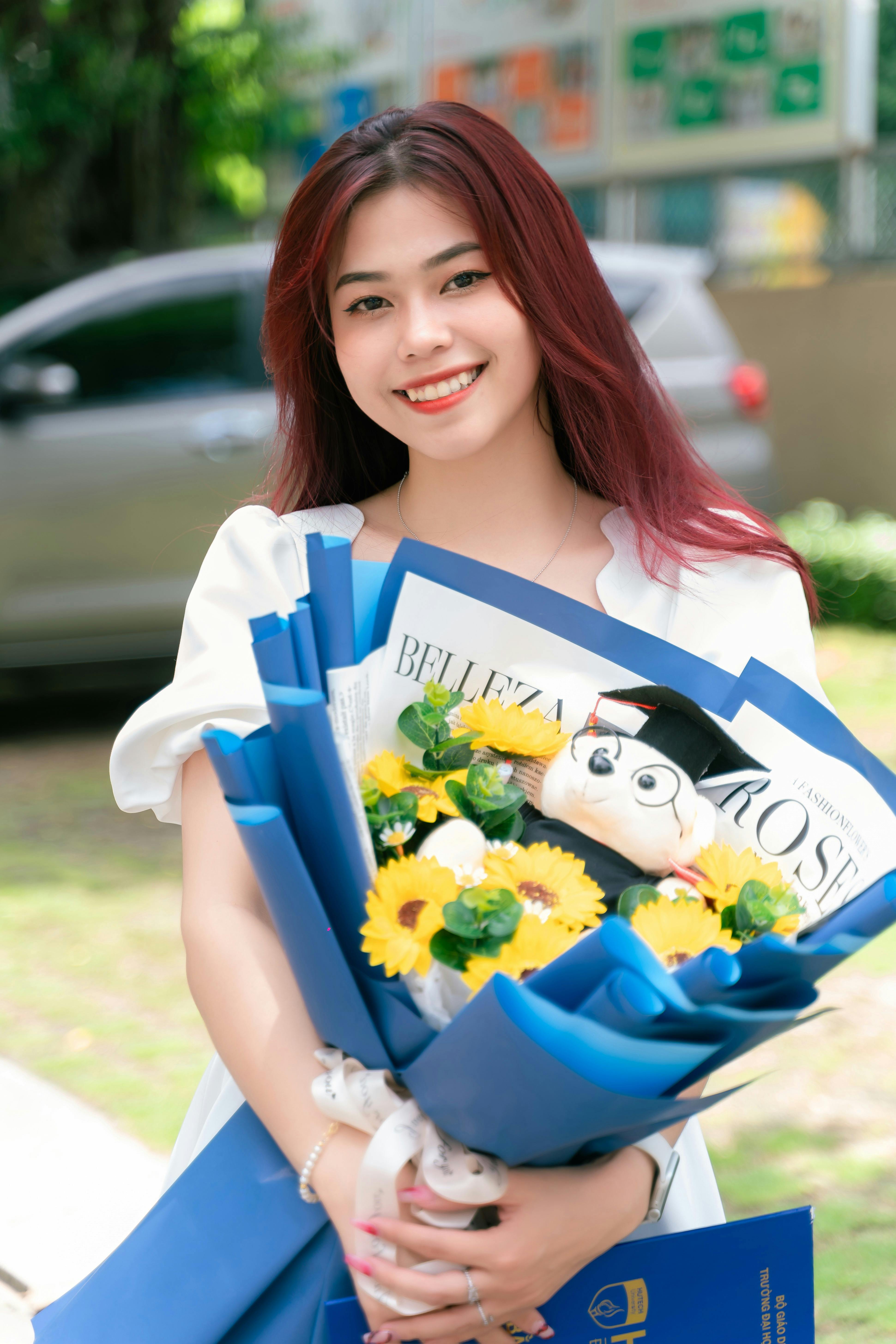 Happy Students Celebrating Graduation Holding Diplomas · Free Stock Photo