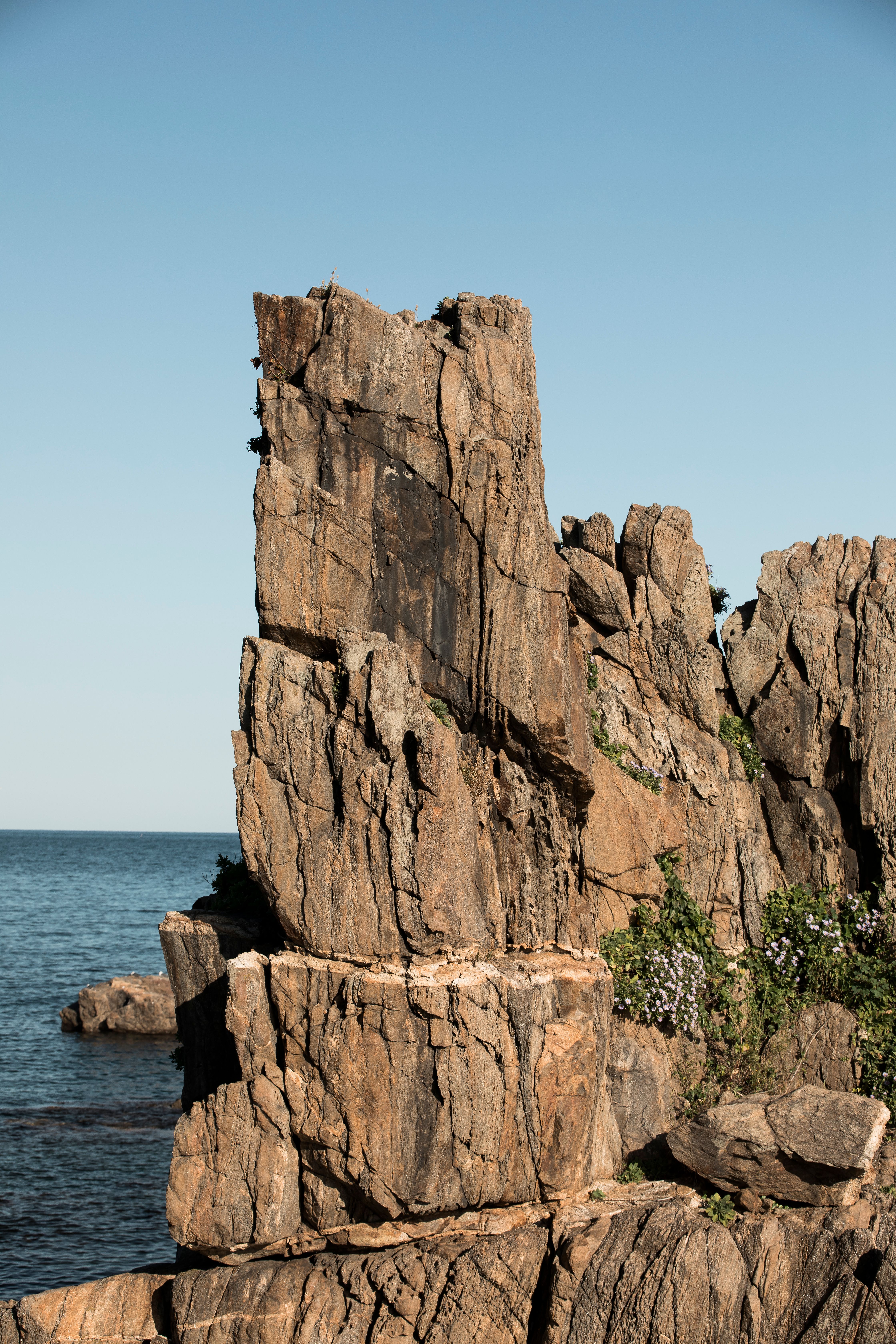 Rocky Cliff by the Shore · Free Stock Photo