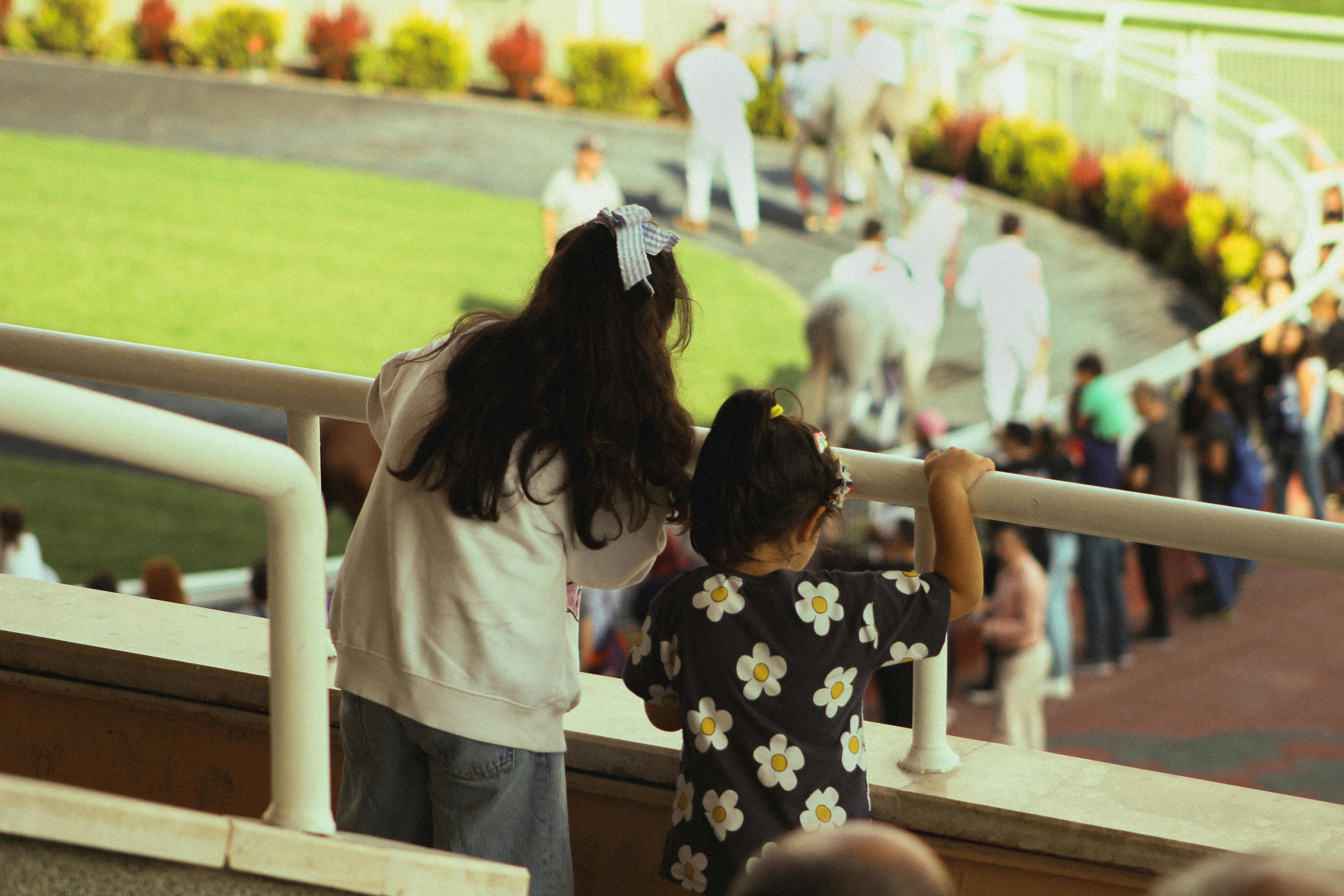 A Child Watching People Play Cricket · Free Stock Photo